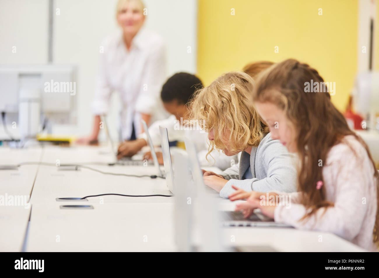 Pupils in a computer class of a primary school learn with fast internet ...