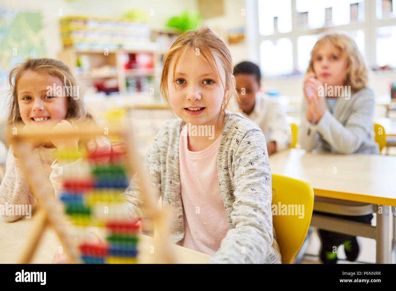 Students learn to count on the abacus in the math class of elementary ...