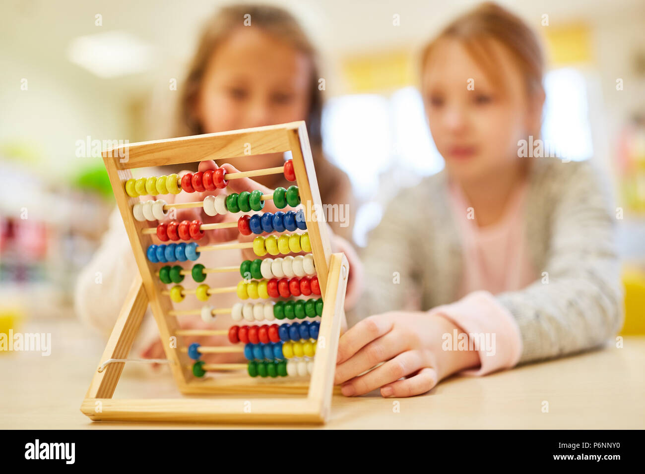 Math lessons with the slide rule or abacus in elementary school Stock ...