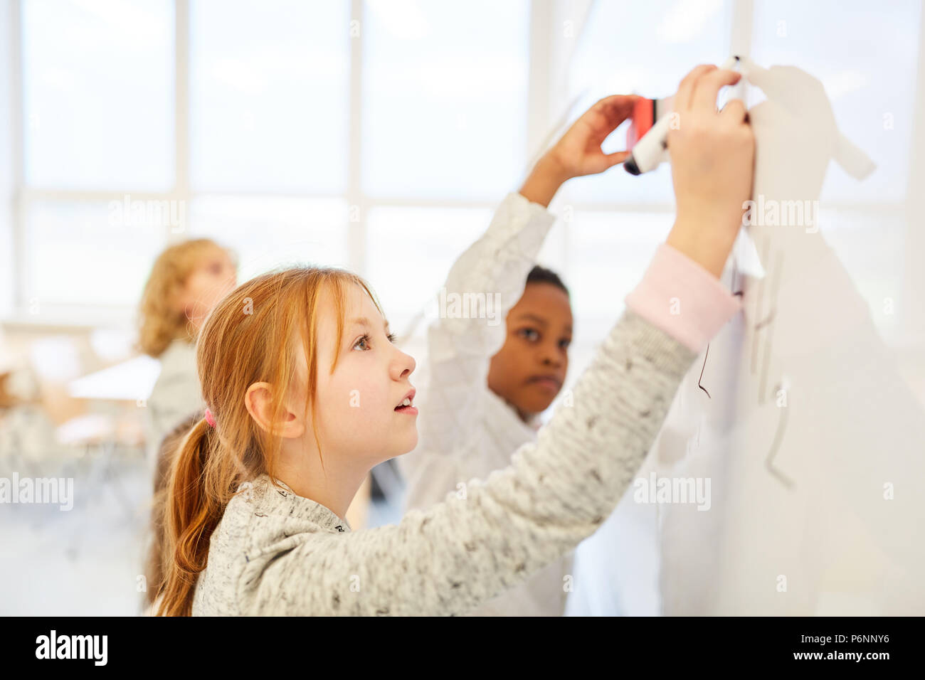 Children count together on the blackboard in math lessons of elementary ...