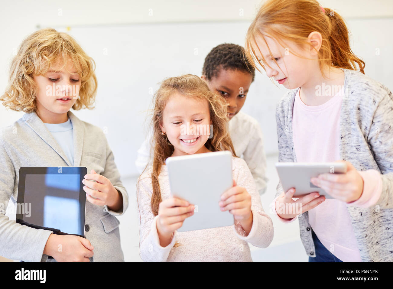 Primary school students enjoy mobile learning with the tablet computer ...
