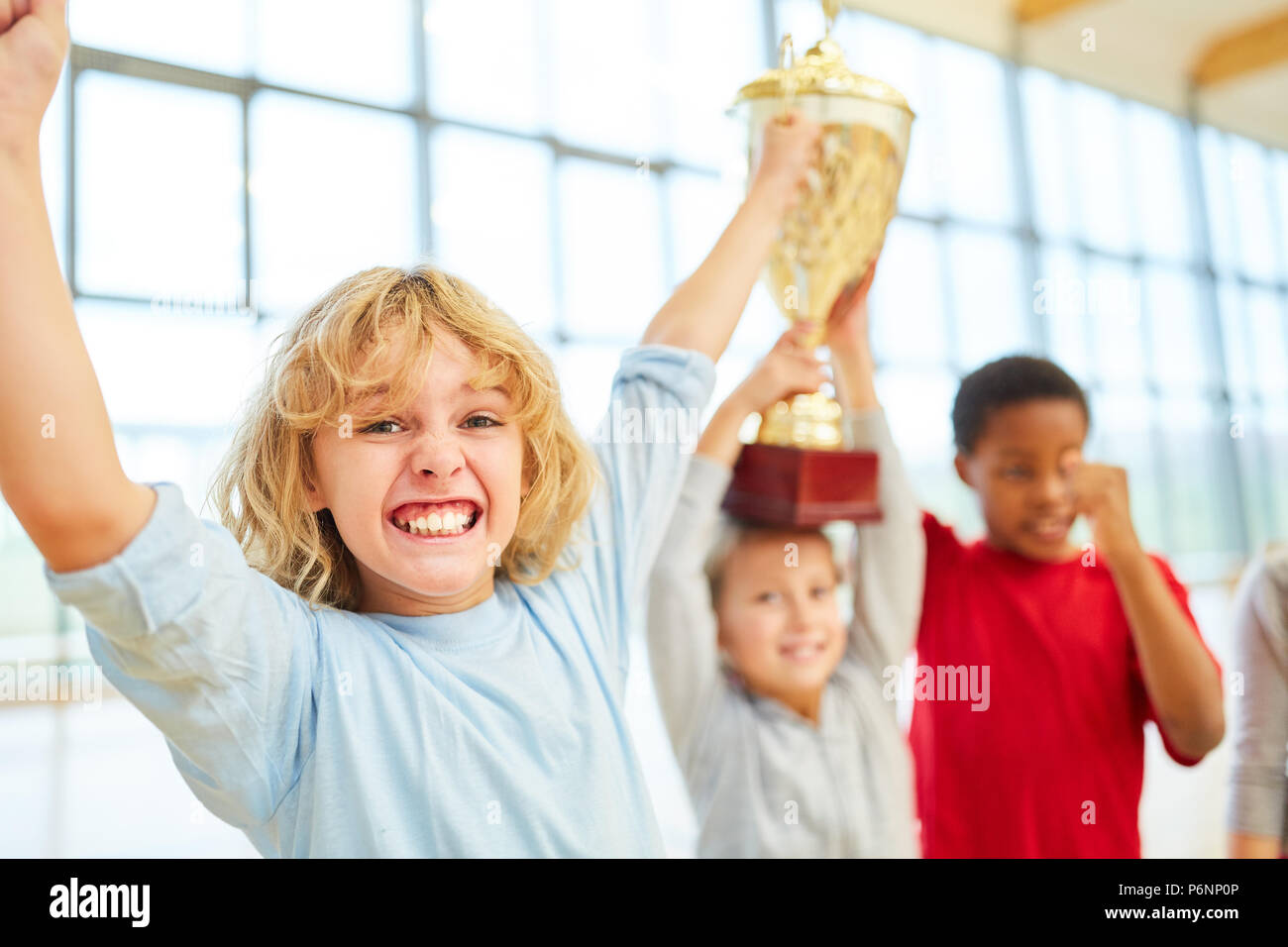 Happy boy cheers with his team after a sport competition Stock Photo ...