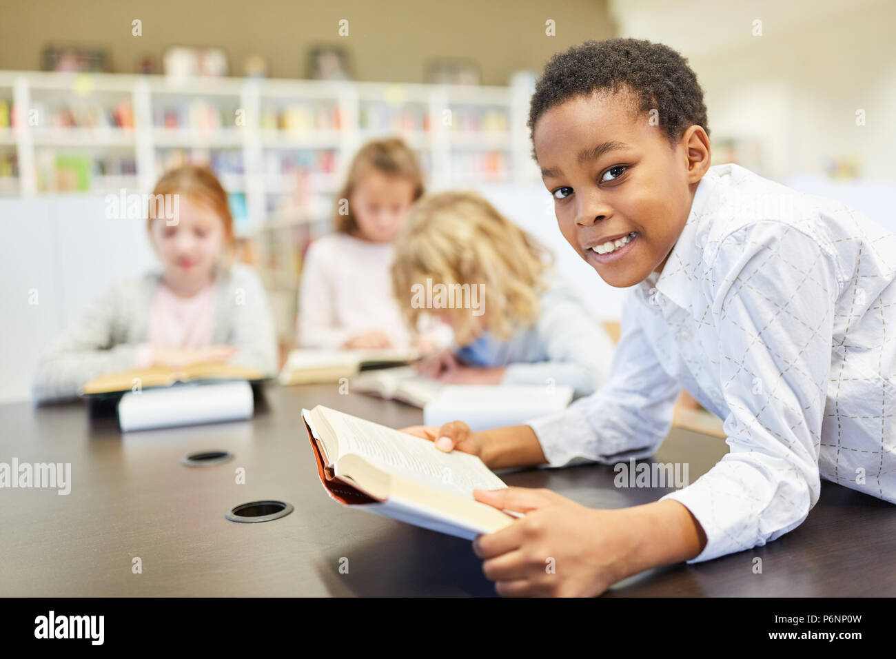 African student and his study group do homework at school Stock Photo ...