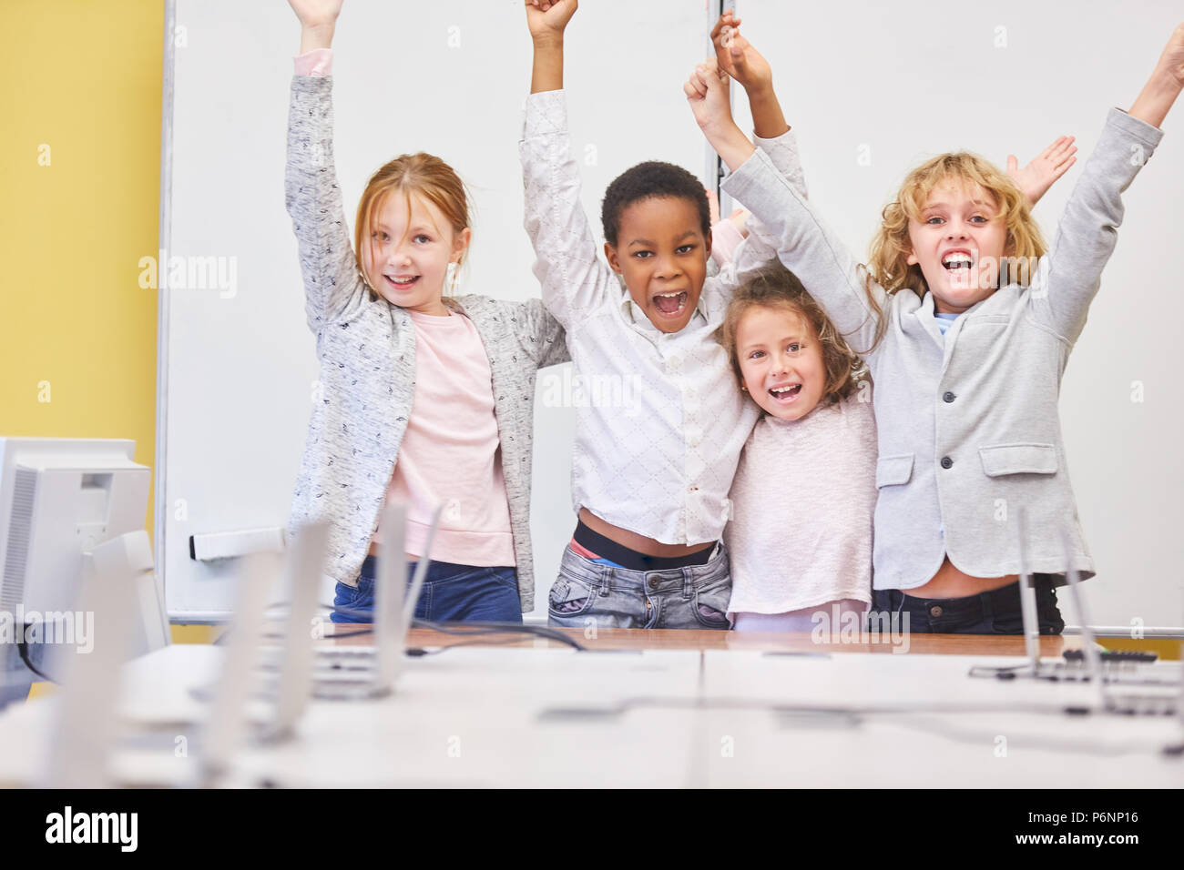 Successful student team of elementary school is happy and cheers happy ...