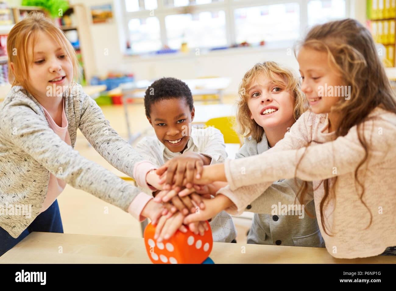 Group children strengthens the team spirit and motivation with hands ...