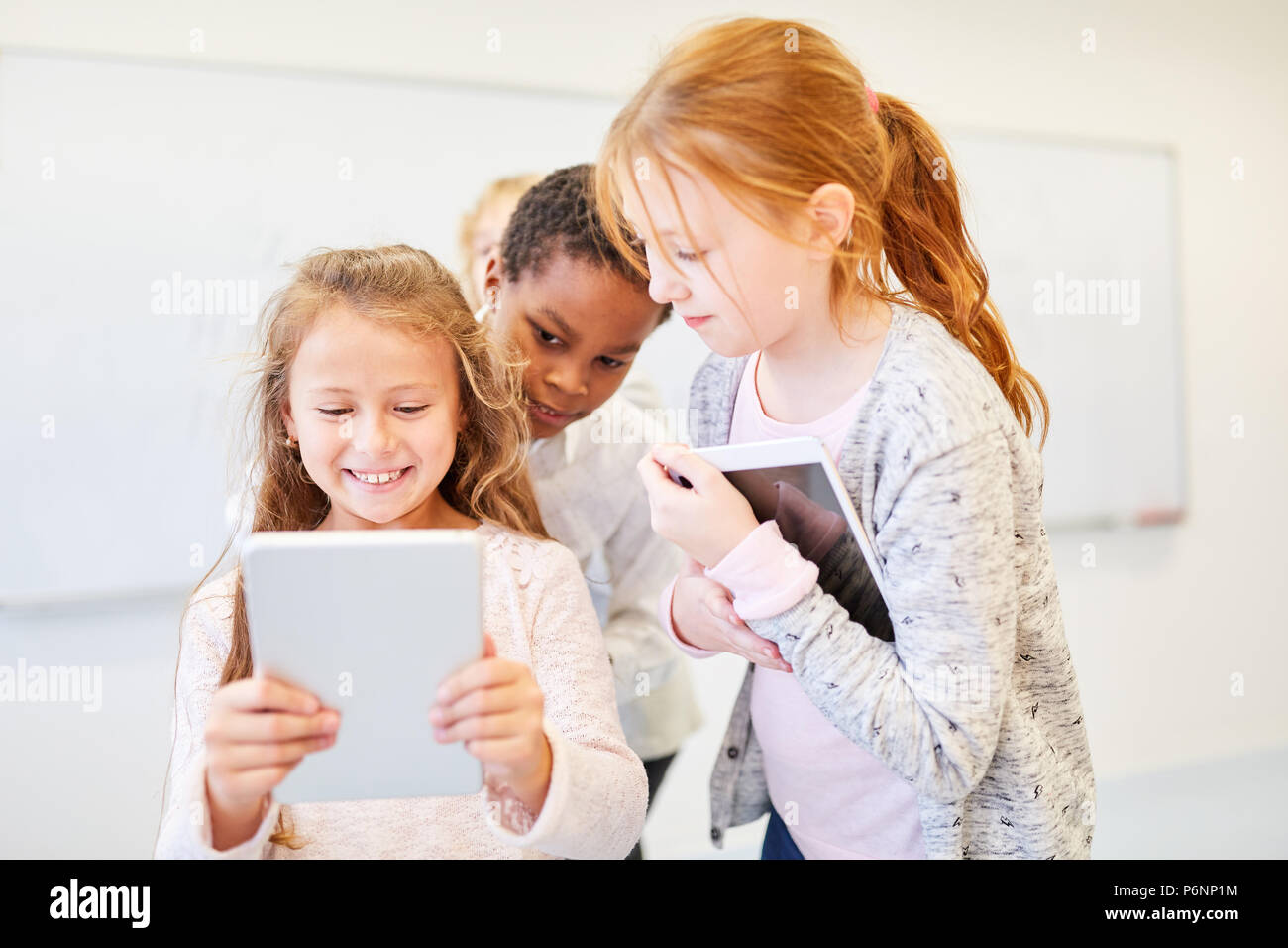 Children in computer science lessons learn online and mobile with ...