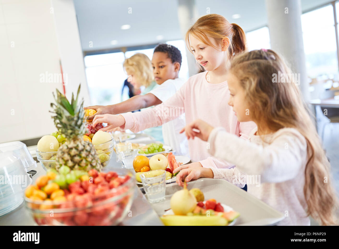 Children get fresh fruit at the canteen buffet in elementary school ...