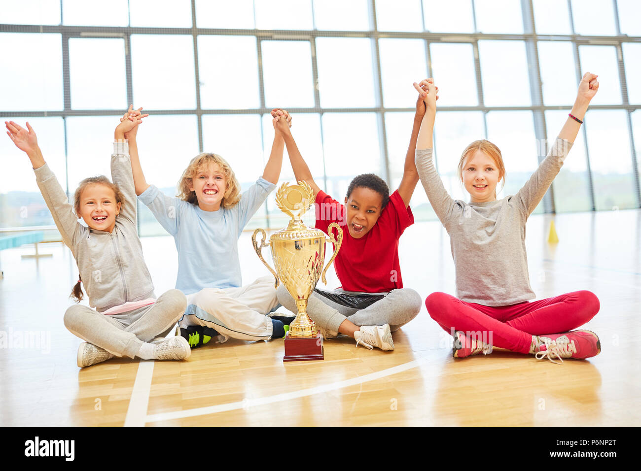 Children's team is happy about winning a cup after a competition Stock ...