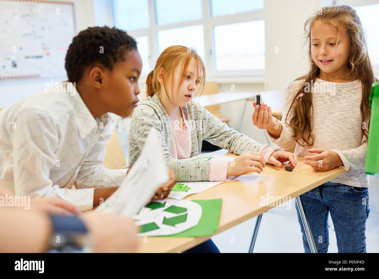 Elementary school students learn about recycling in teaching in ...