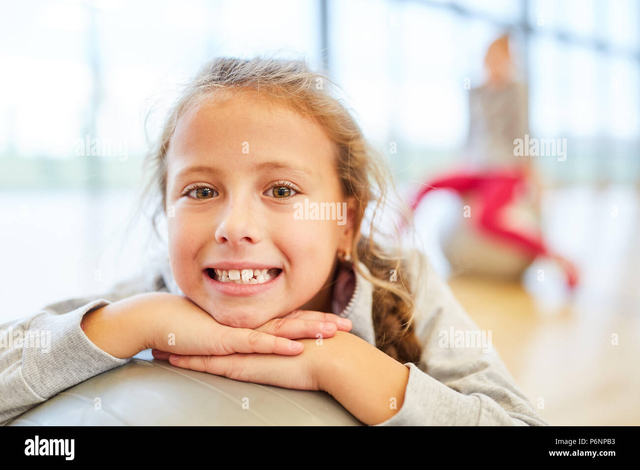 Girls as students in elementary school physical education take a break ...