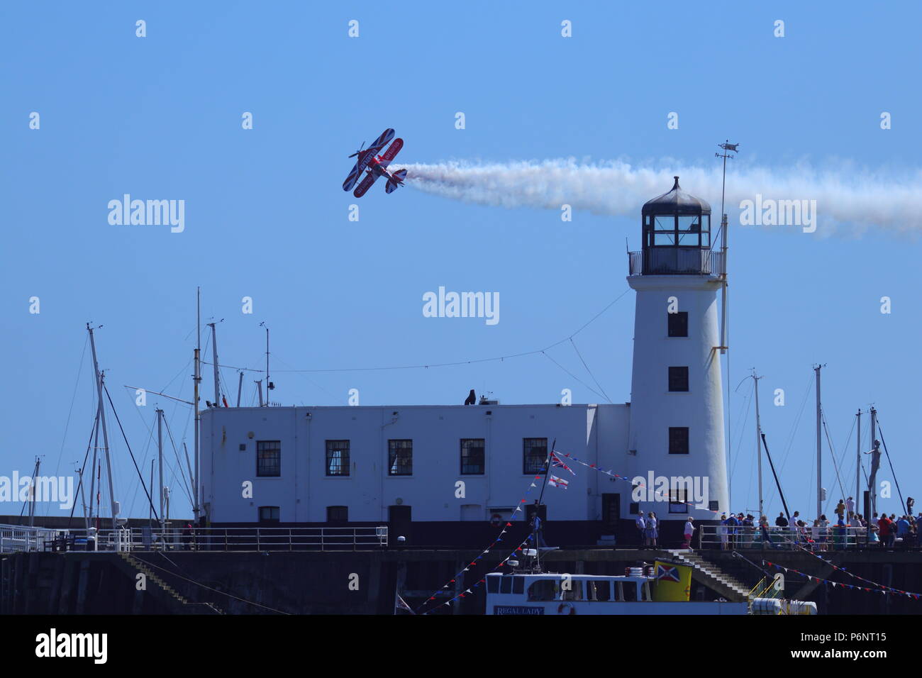 Rich Goodwin's Bi-plane flypasts the lighthouse during one of his ...