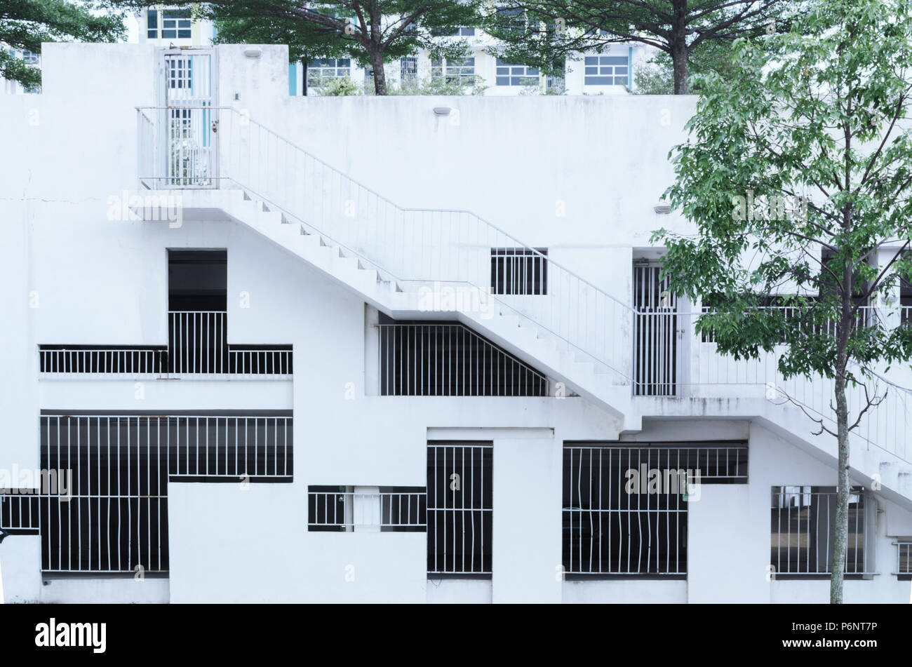 Abstract facade surrounded by trees, architectural background - grille ...