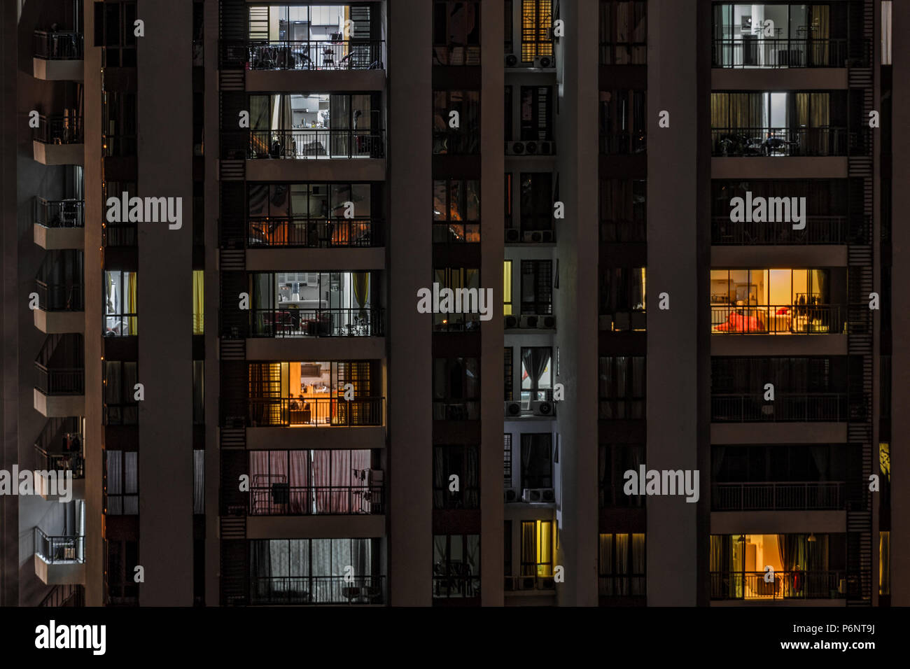 Background with night life in big city - front view of modern high-rise ...