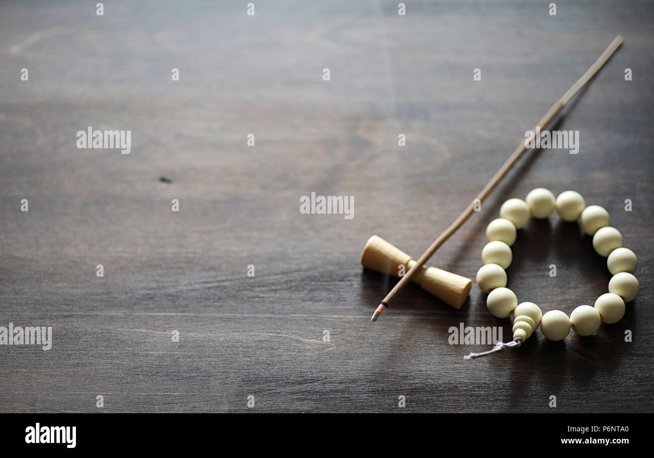 Different objects with traditional religious oriental on a wooden ...
