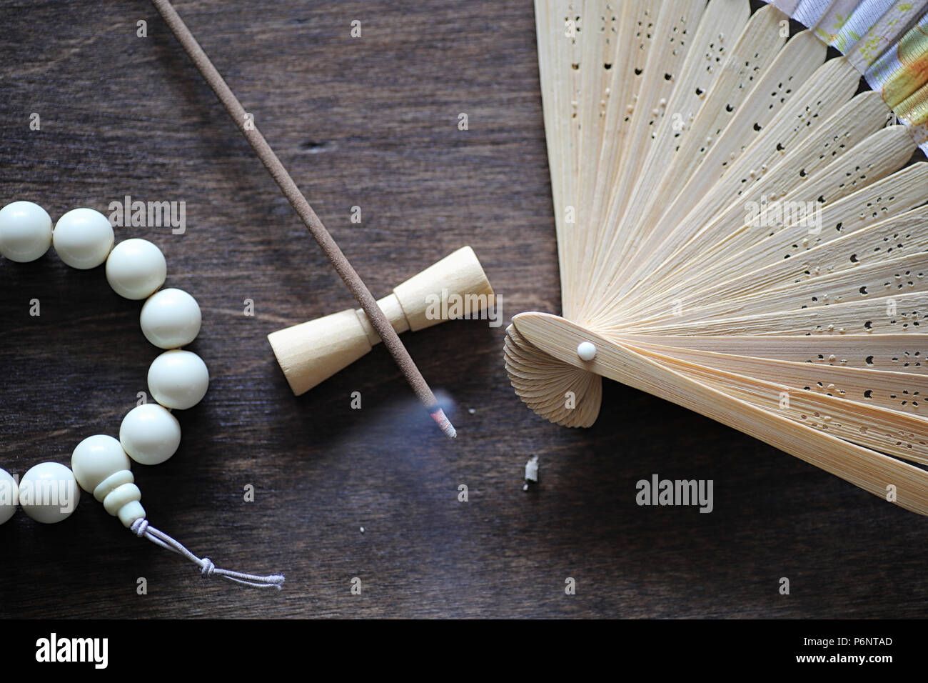 Different objects with traditional religious oriental on a wooden ...