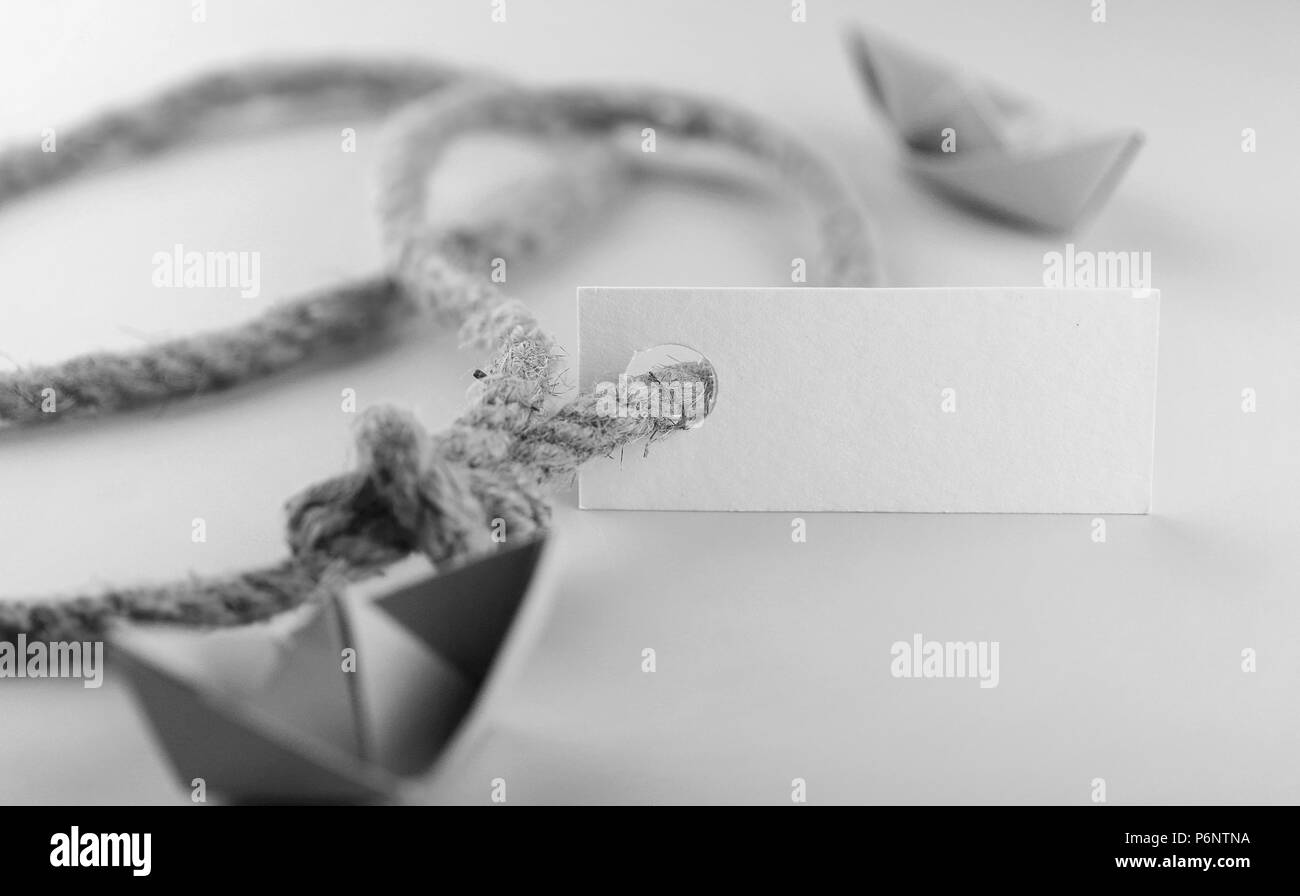 white sticker with thick braided rope and ship paper origami Stock ...