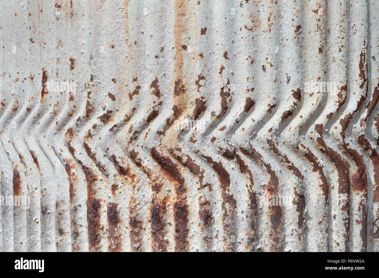 Chevron pattern creased into steel drum which has been used as ...