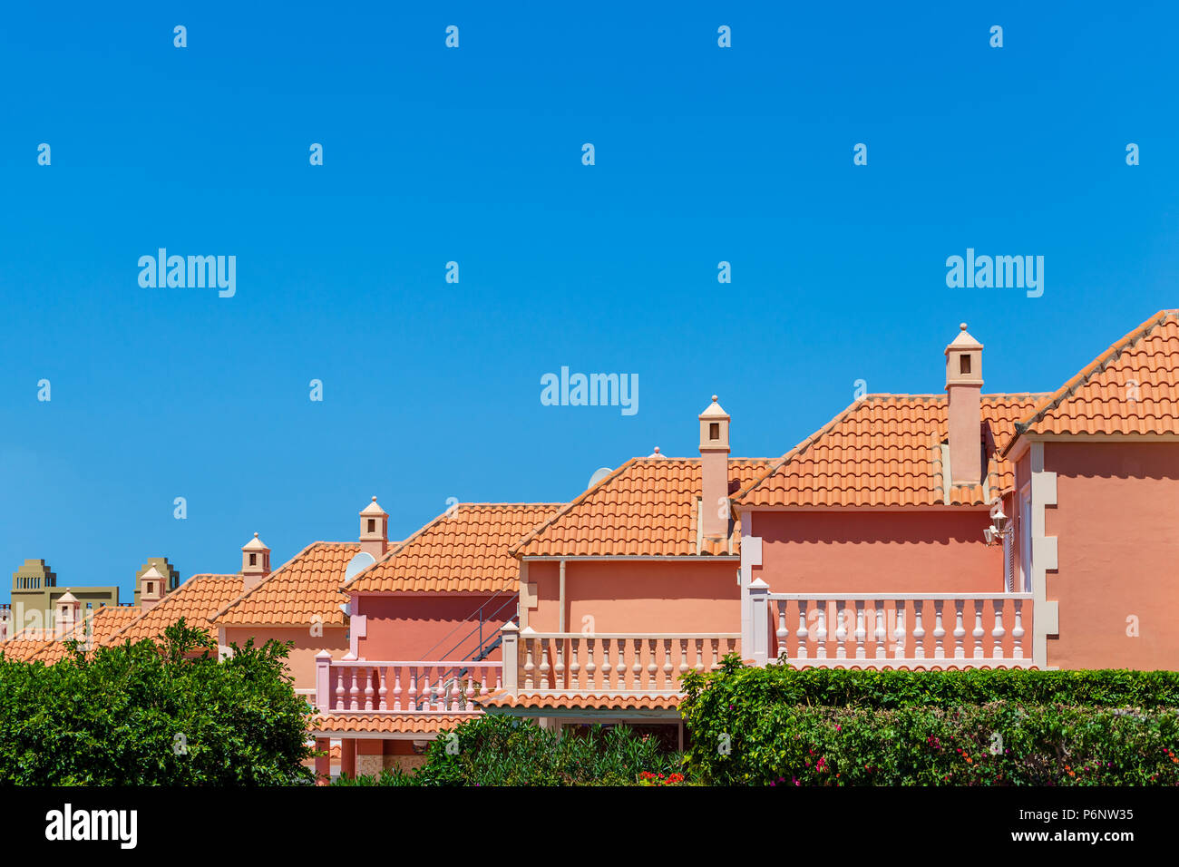 Tile on roofs houses built in row Stock Photo - Alamy