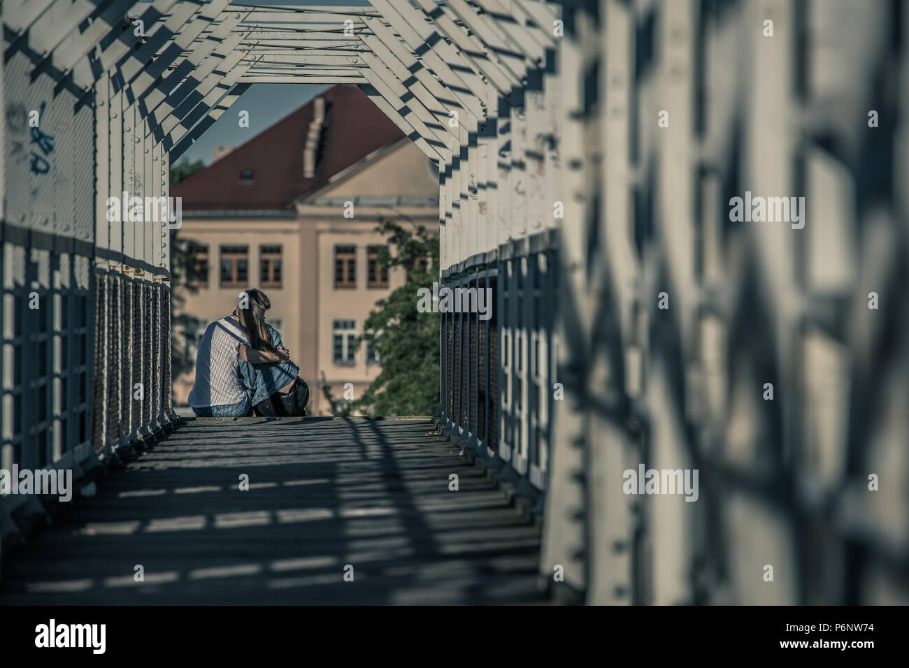Back view young couple cuddling hi-res stock photography and images - Alamy