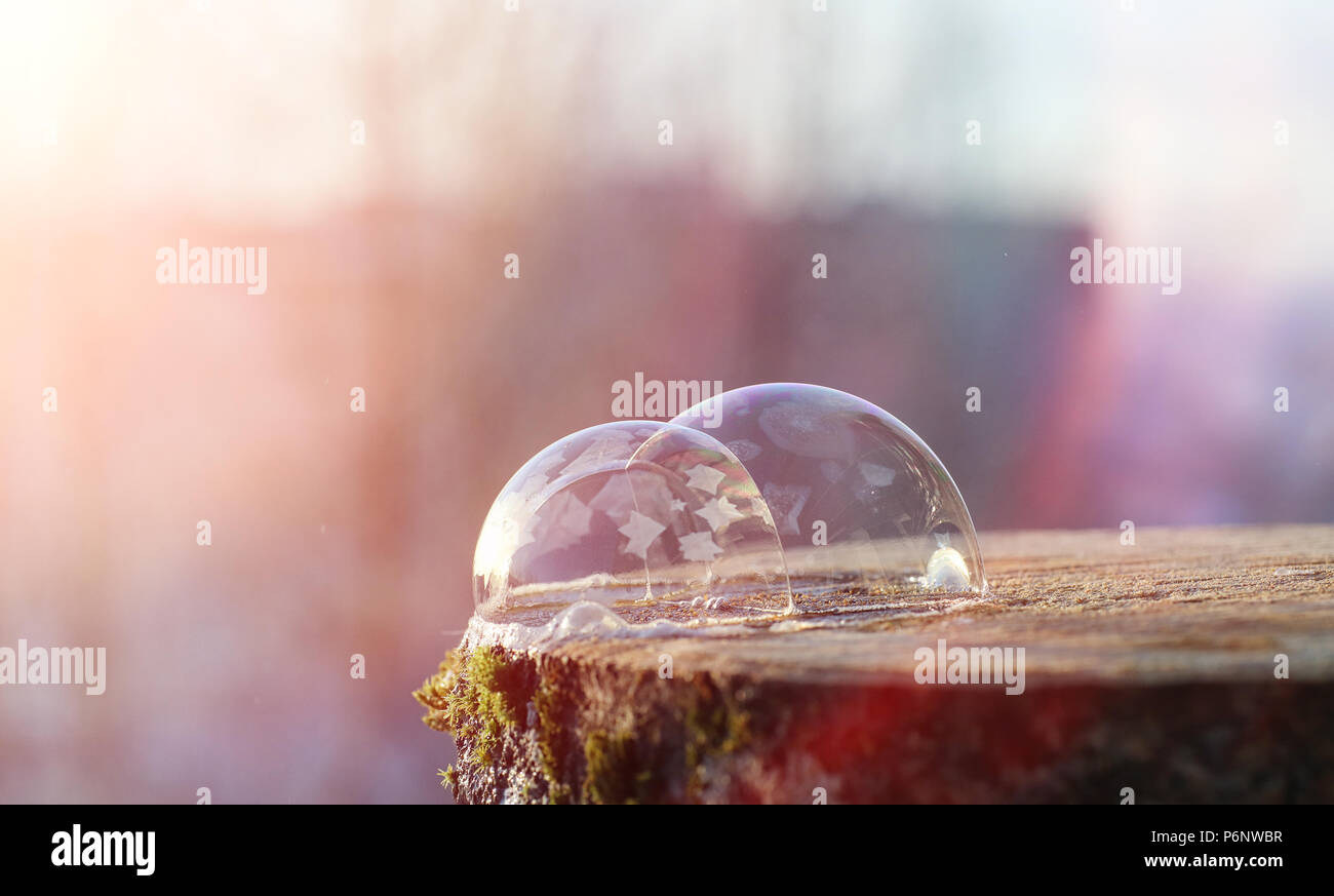 Soap bubbles freeze in the cold. Winter soapy water freezes in air ...