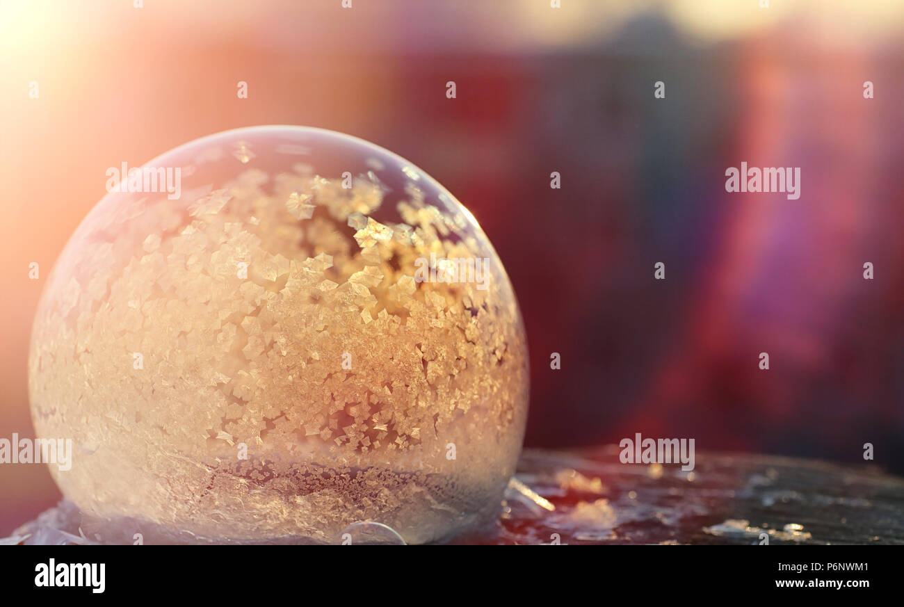 Soap bubbles freeze in the cold. Winter soapy water freezes in air ...