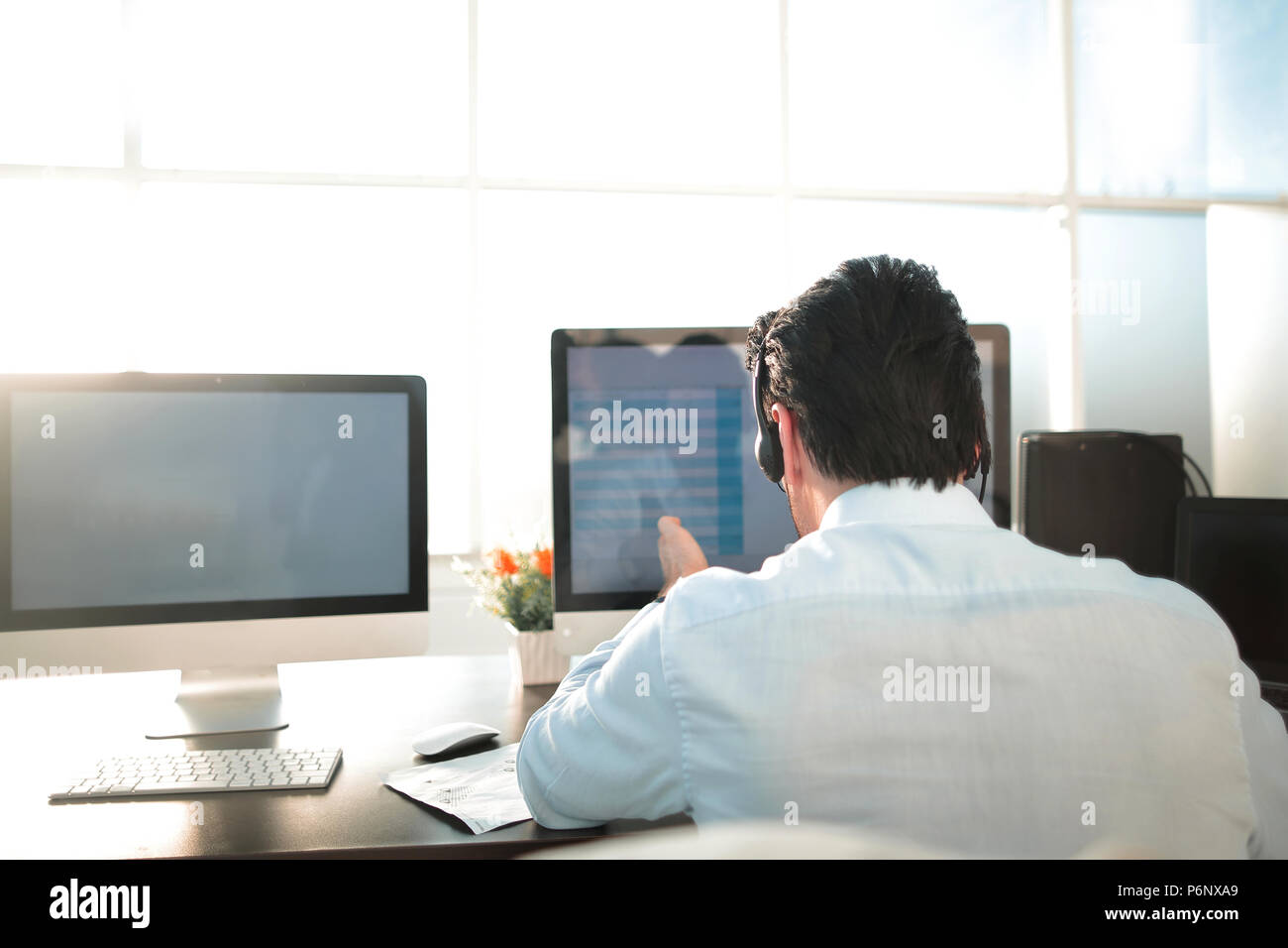 businessman analyzes the data sitting in the office Stock Photo - Alamy