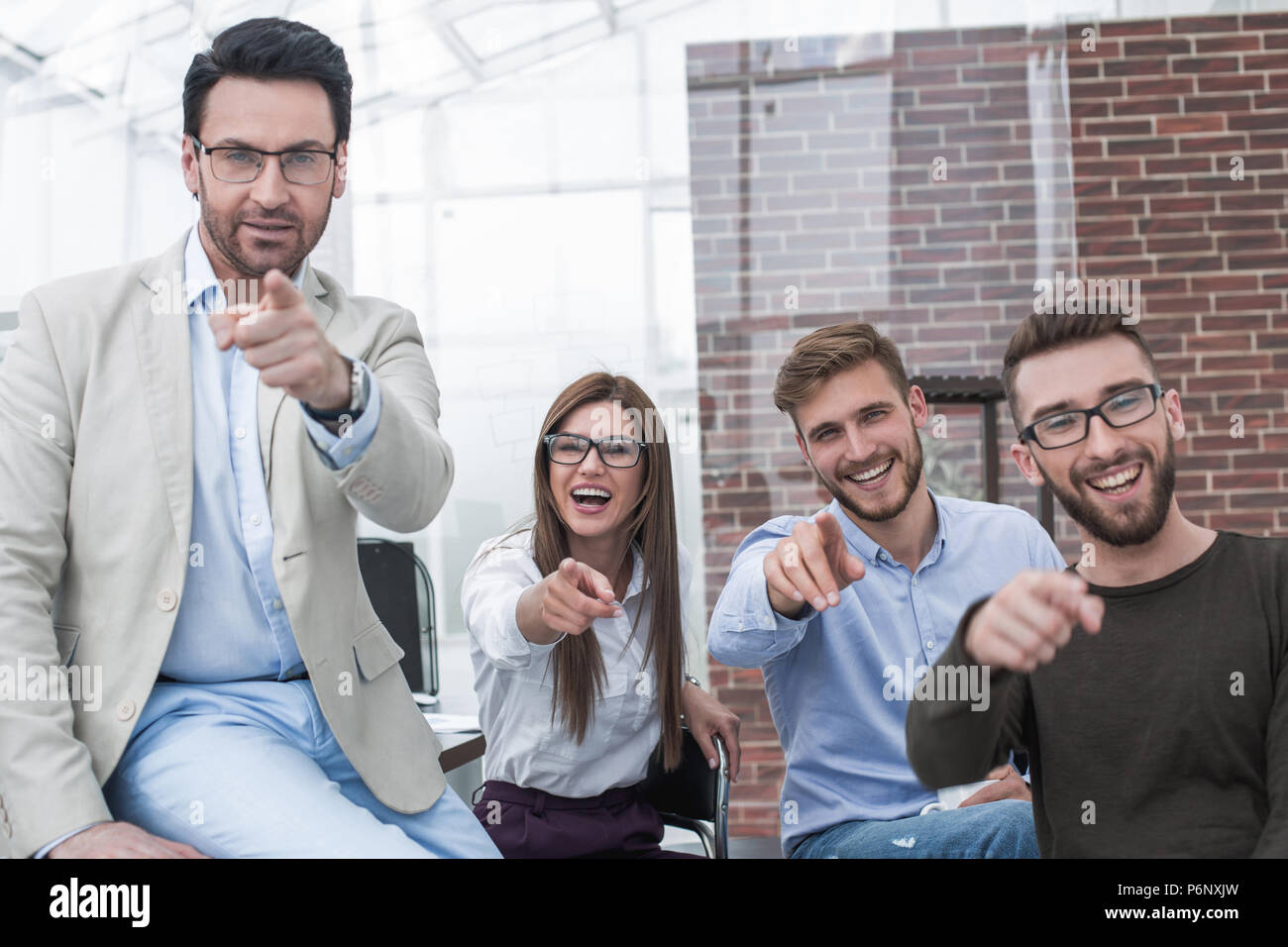 group of employees pointing their fingers at you Stock Photo - Alamy