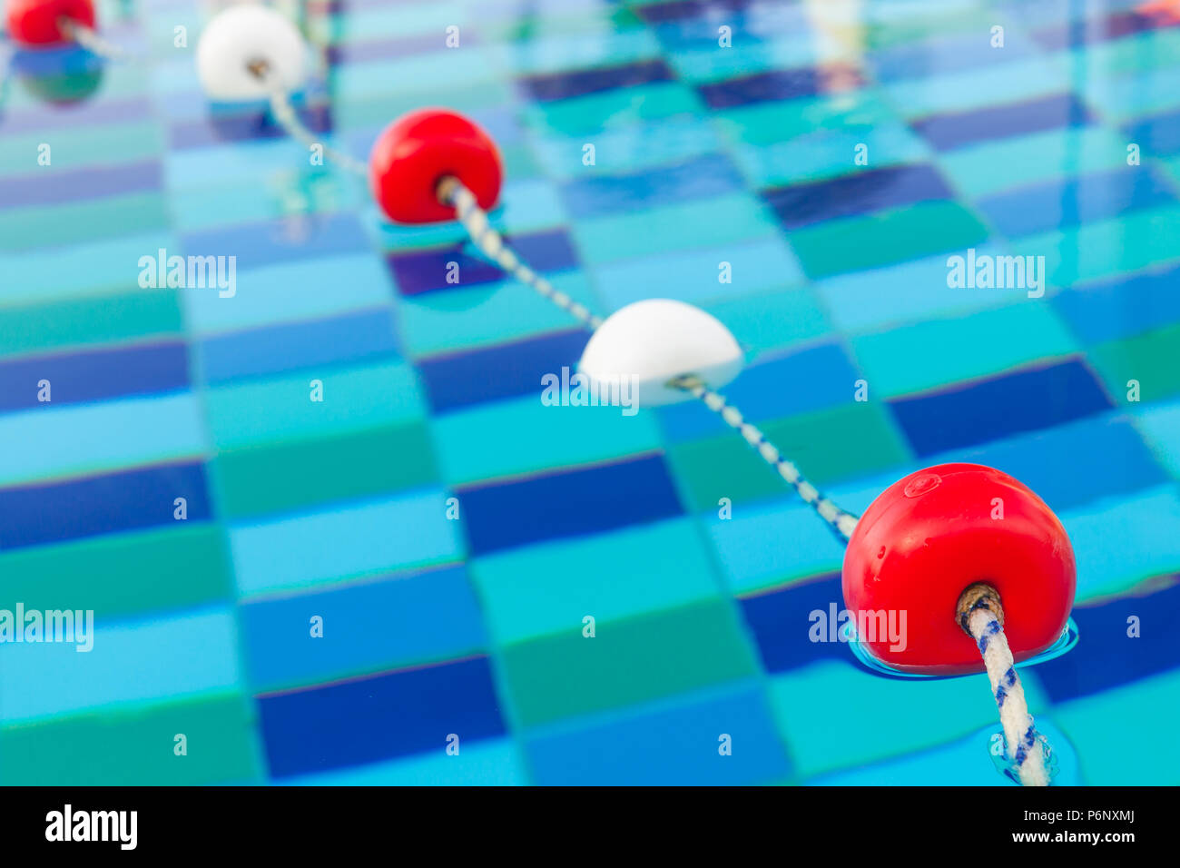 Red and white plastic floats on rope, swimming pool lane border Stock ...