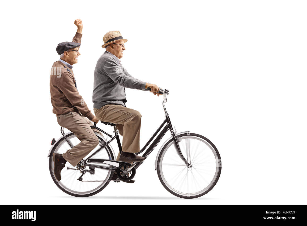 Two cheerful elderly men riding a bicycle together isolated on white ...