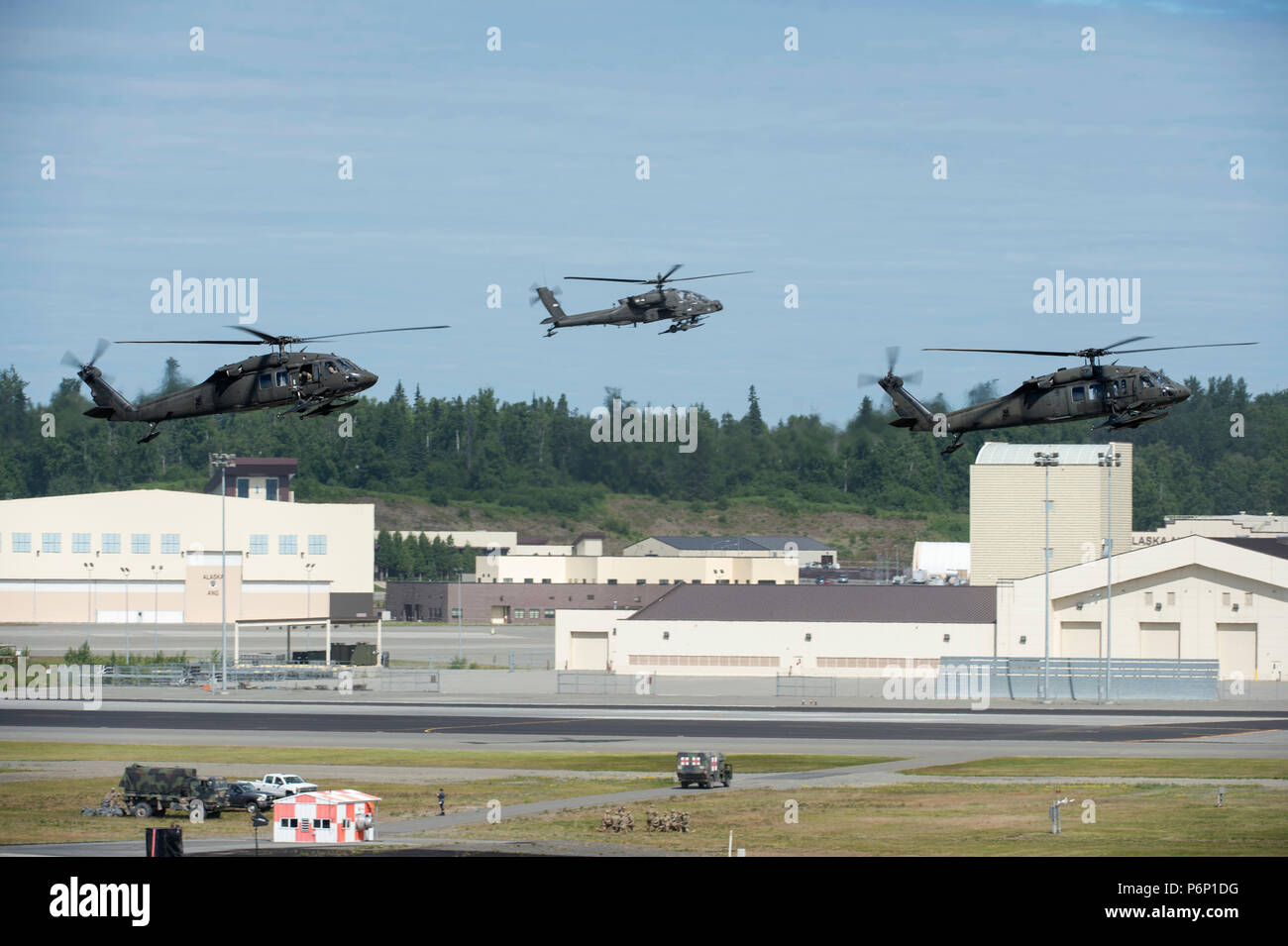 Two Alaska Army National Guard UH-60 Black Hawks and a U.S. Army AH-64 ...