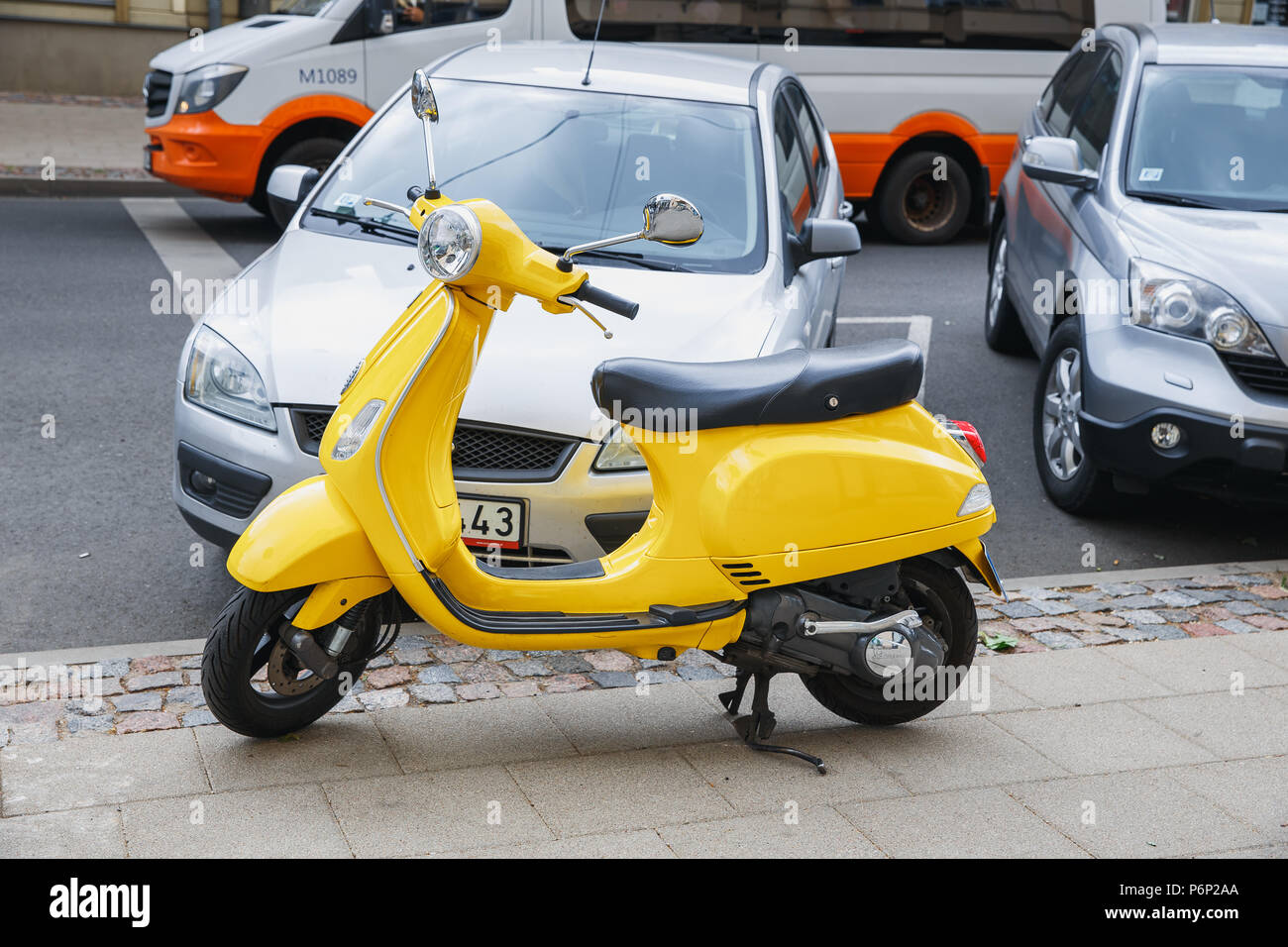 City Riga, Latvia. Retro Scooter Vespa at street, yellow color. Urban ...