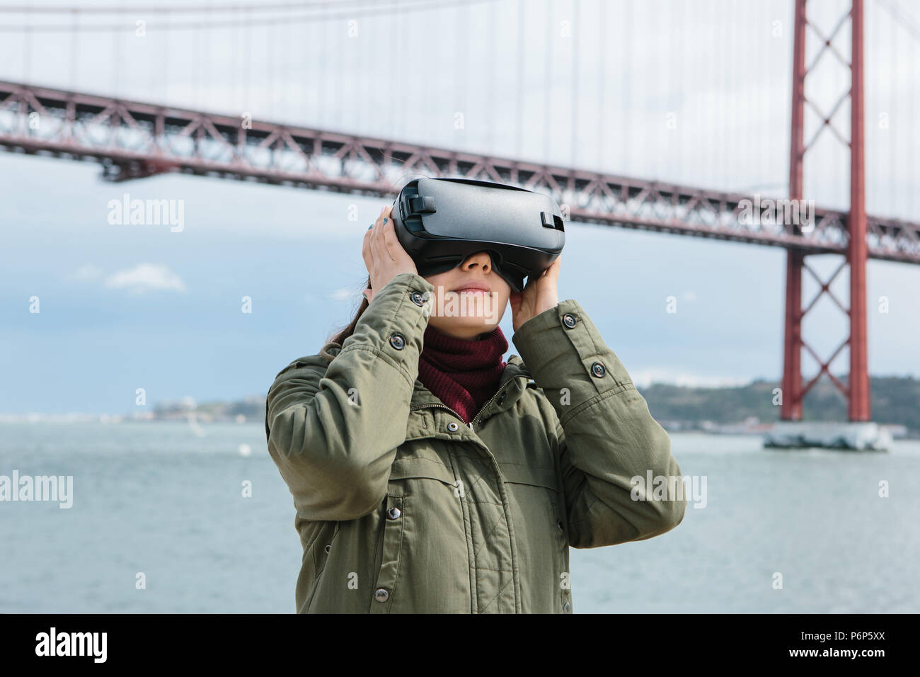 Young beautiful girl wearing virtual reality glasses. 25th of April ...