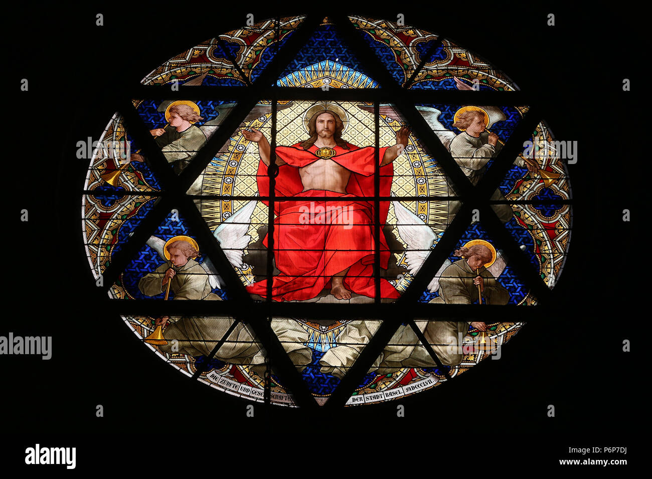 Basel Cathedral Minster. Stained glass window. Jesus in glory inside a ...