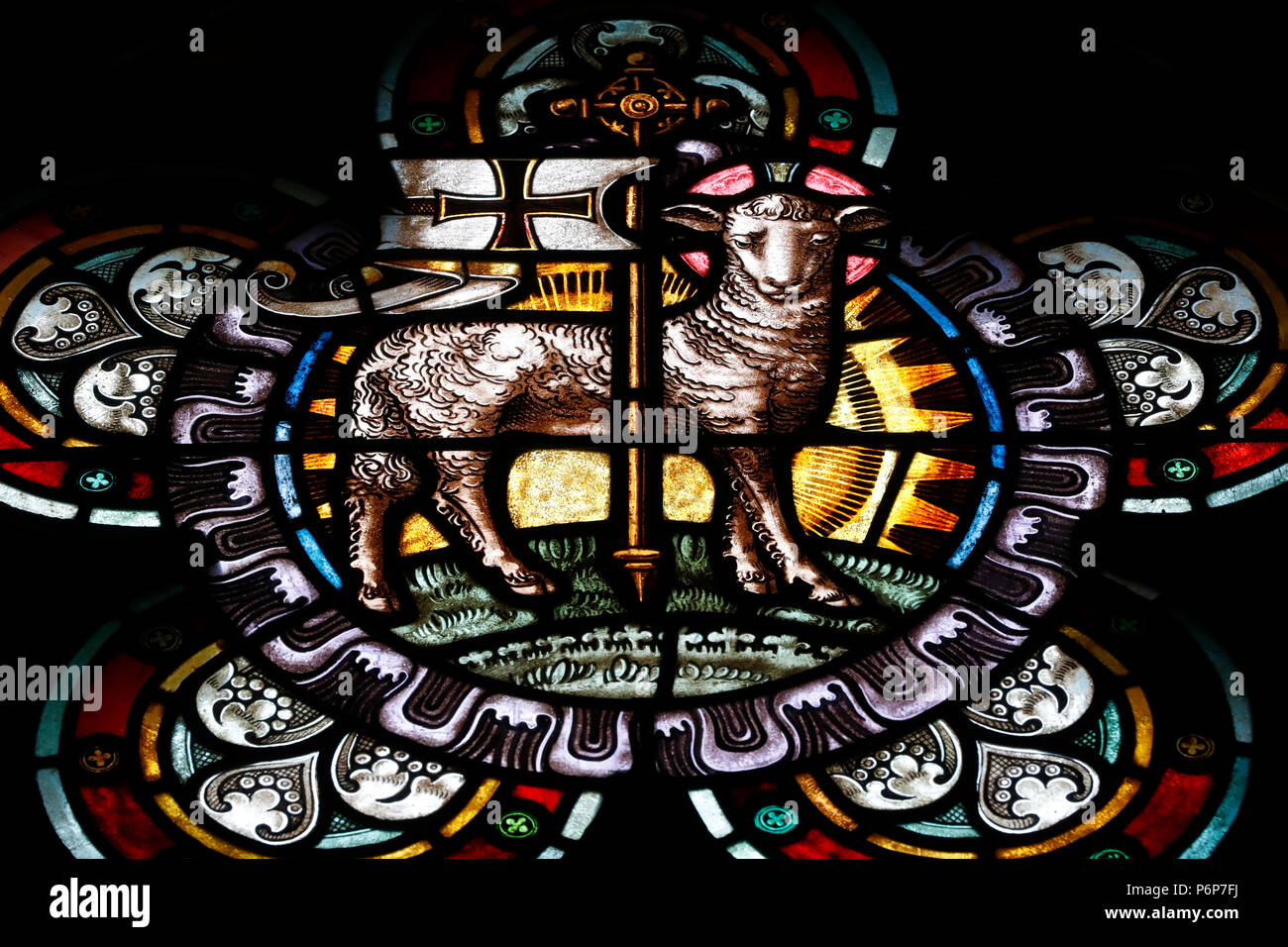 Holy trinity stained glass lamb hi-res stock photography and images - Alamy