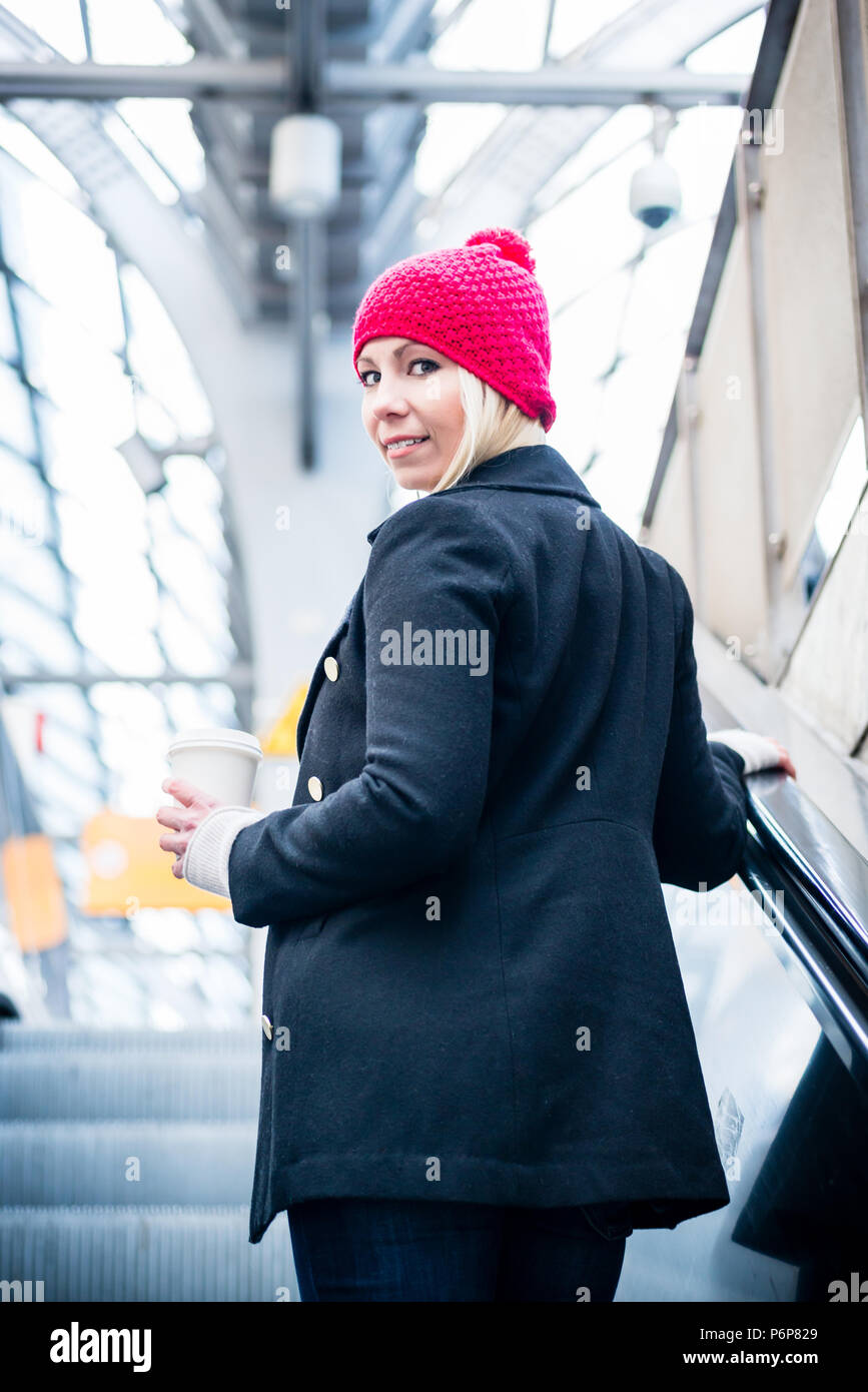 Woman walking on train platform Stock Photo - Alamy