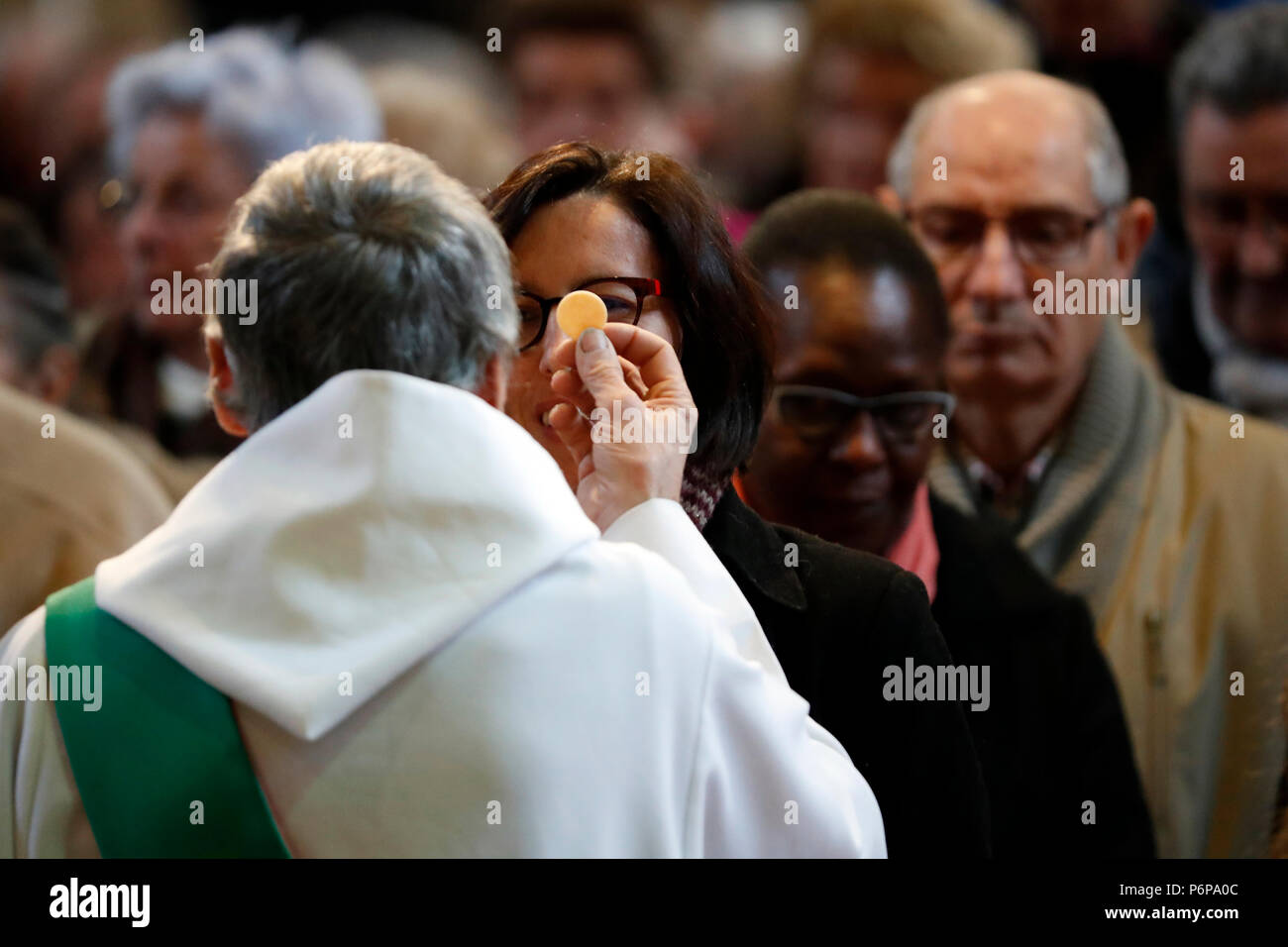 Roman catholic priest holy communion hi-res stock photography and ...