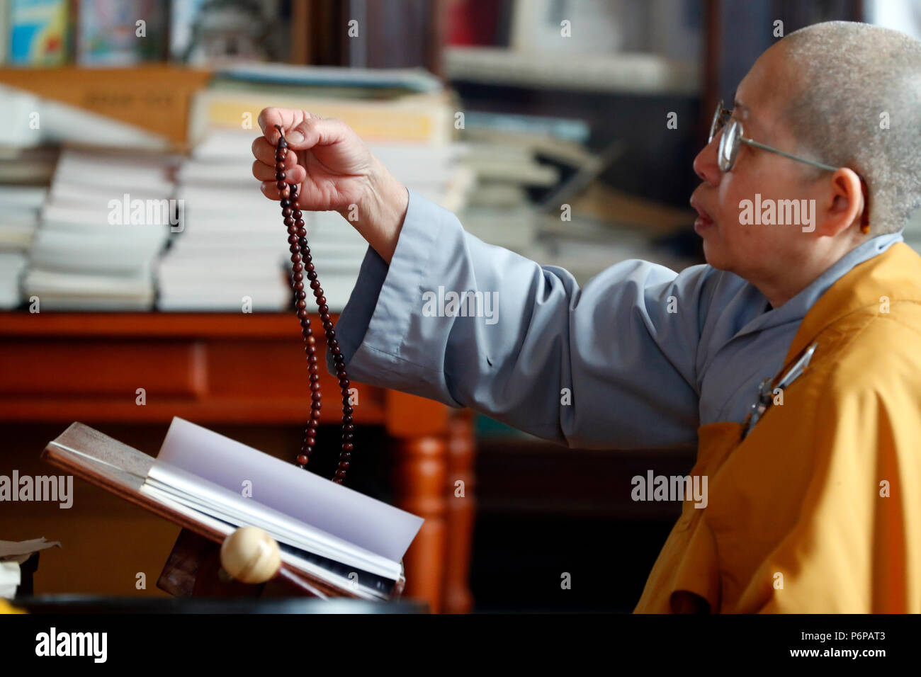 Chua Tu An Buddhist temple. Monk at buddhist ceremony. Buddhist prayer ...