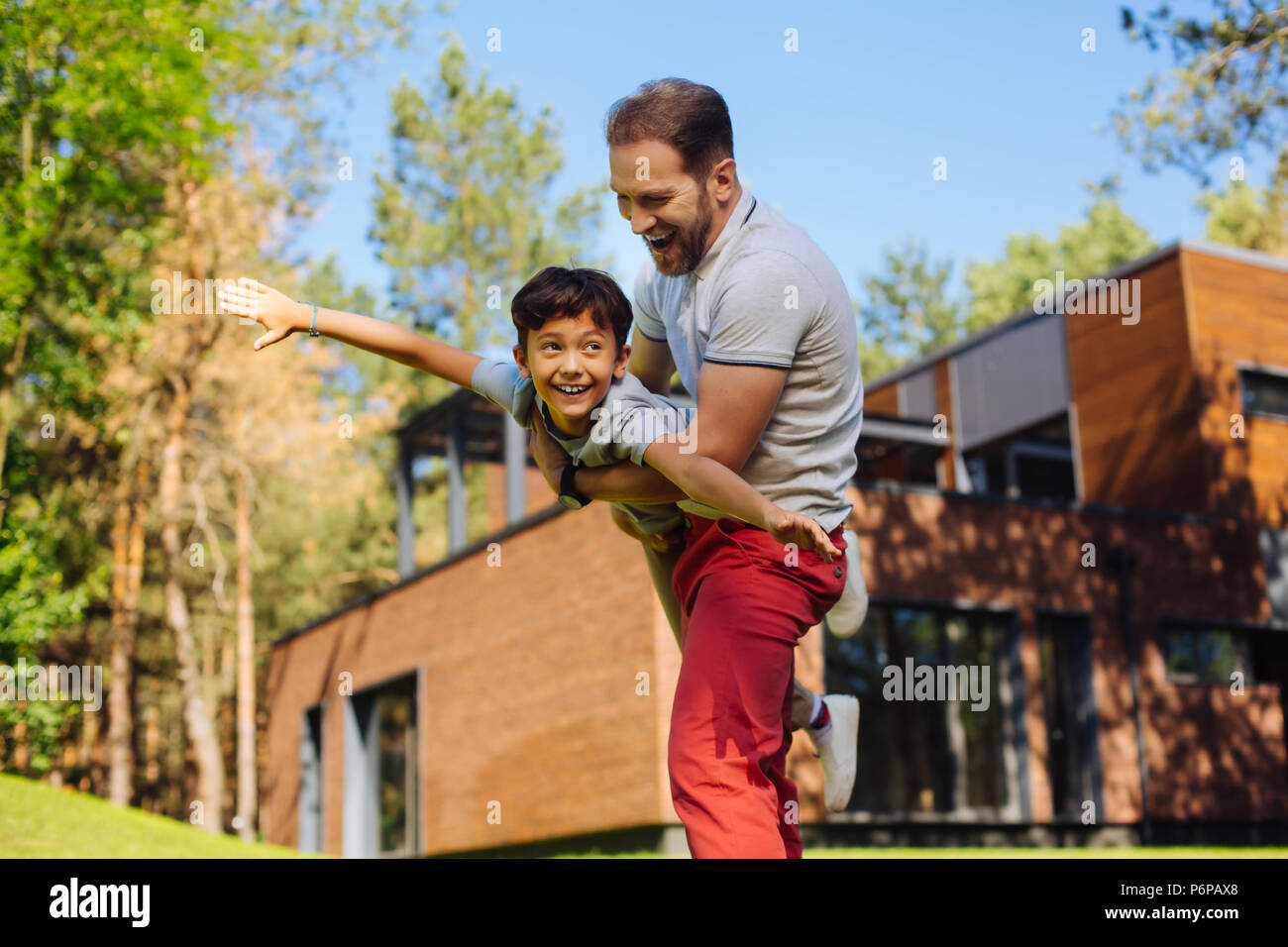 Happy daddy spending time with his son Stock Photo - Alamy