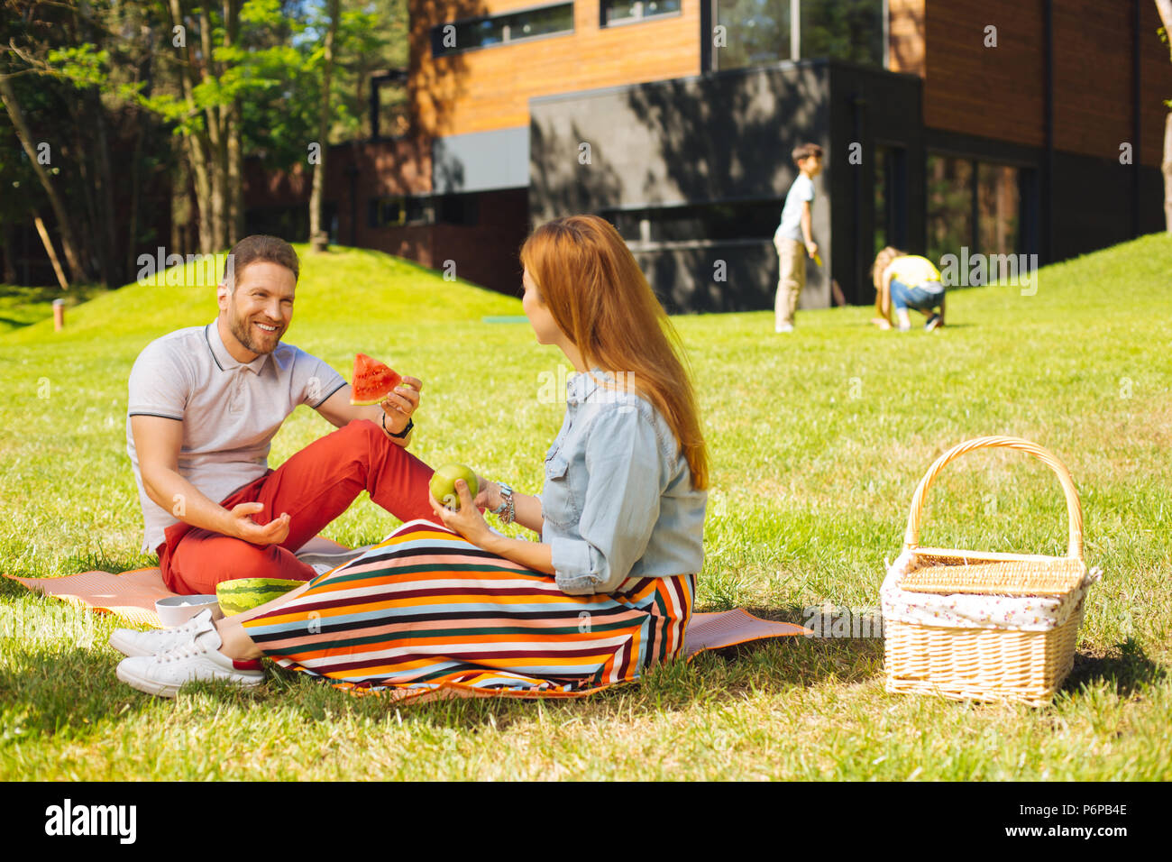 Delighted family having lunch outside Stock Photo - Alamy
