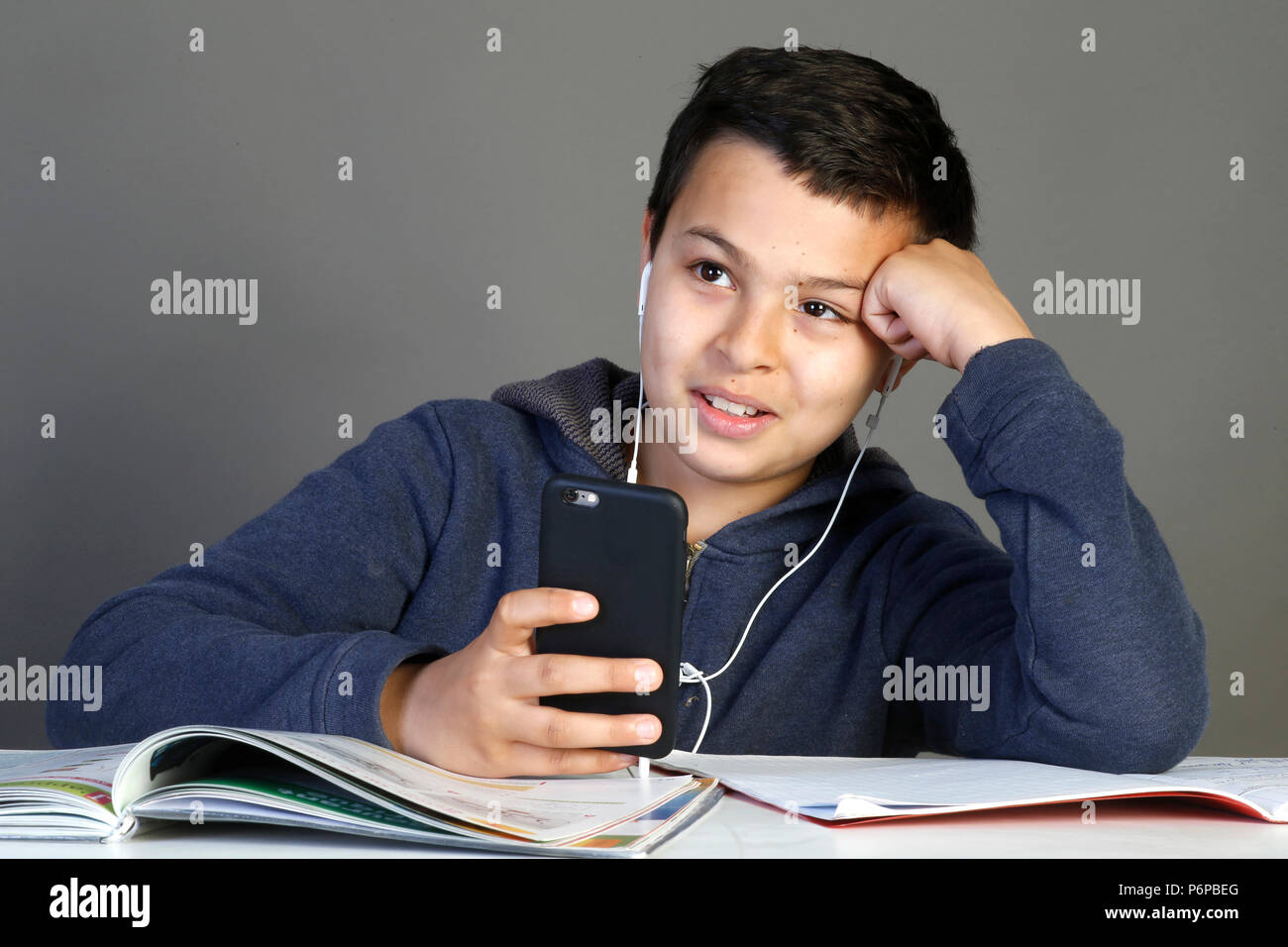 12-year-old schoolboy using a cell phone. Paris, France Stock Photo - Alamy