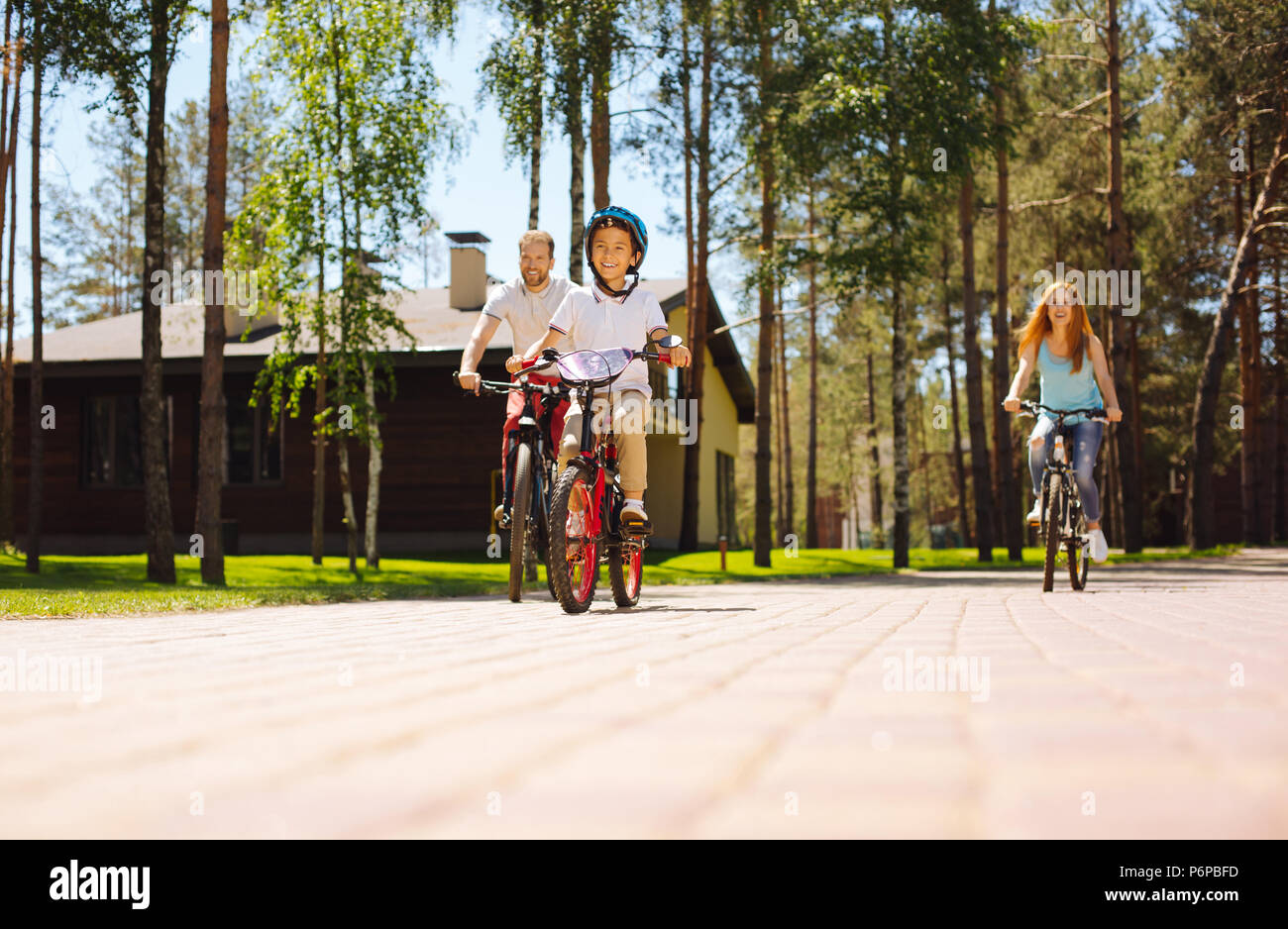 Family happy summer bikes hi-res stock photography and images - Alamy