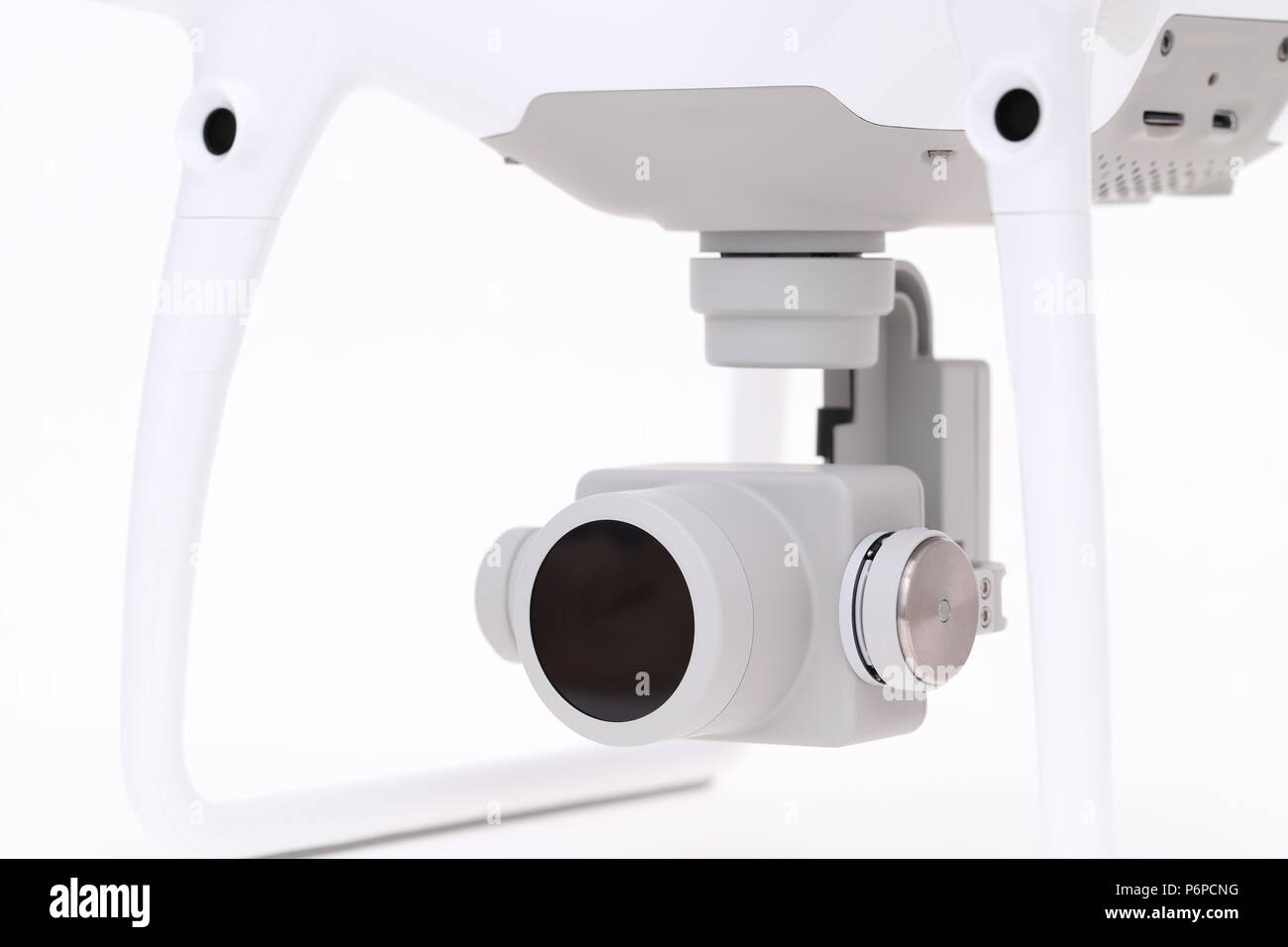 Close up of small camera on gimbal of drone on white background Stock ...