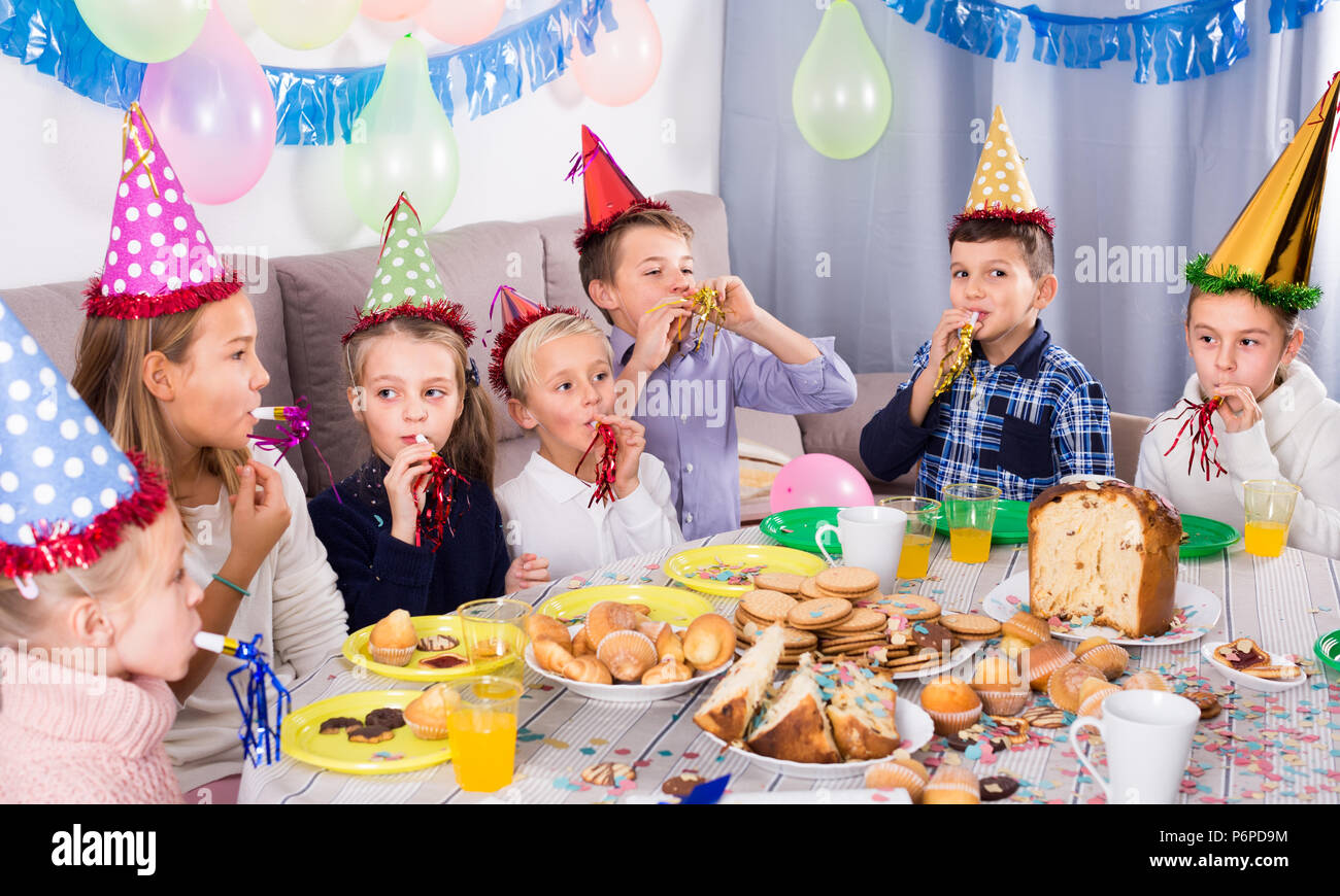 cheerful children having good time during friend’s birthday party Stock ...
