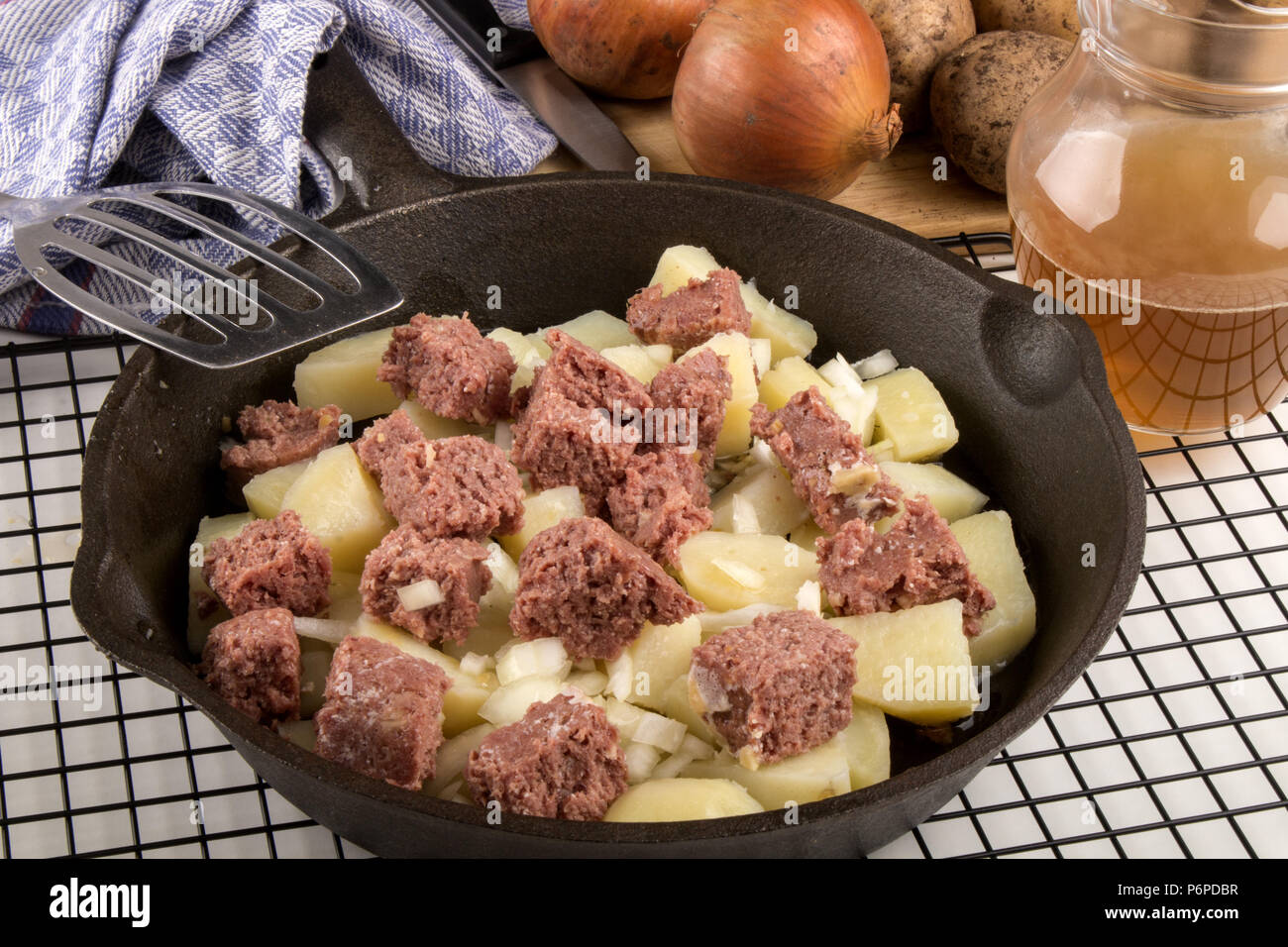 very irish meal, raw corned beef hash in a cast iron pan Stock Photo ...