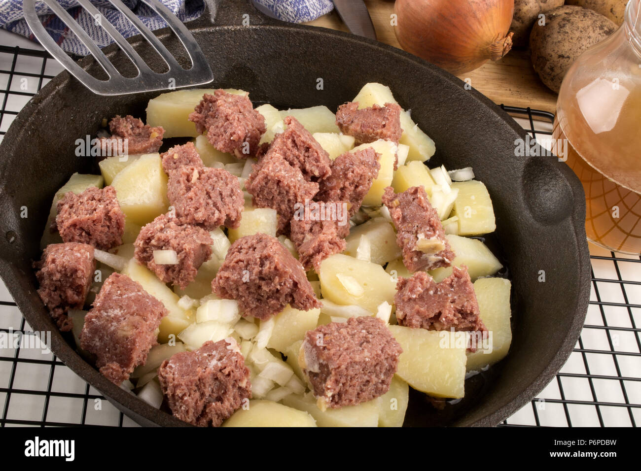 very irish meal, raw corned beef hash in a cast iron pan Stock Photo ...