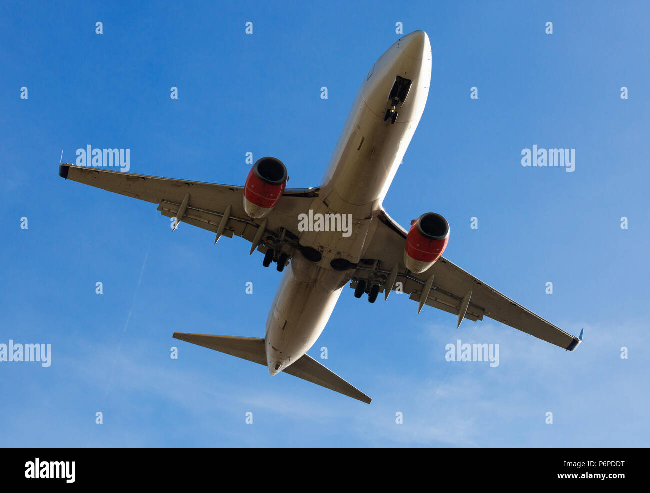 New passenger plane departing from runway in airport in afternoon Stock ...