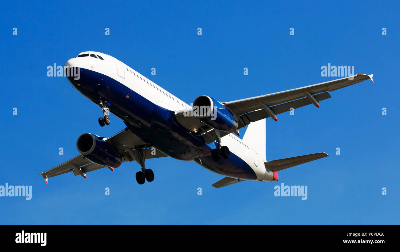 Spacious passenger airliner flying in sky towards destination Stock ...