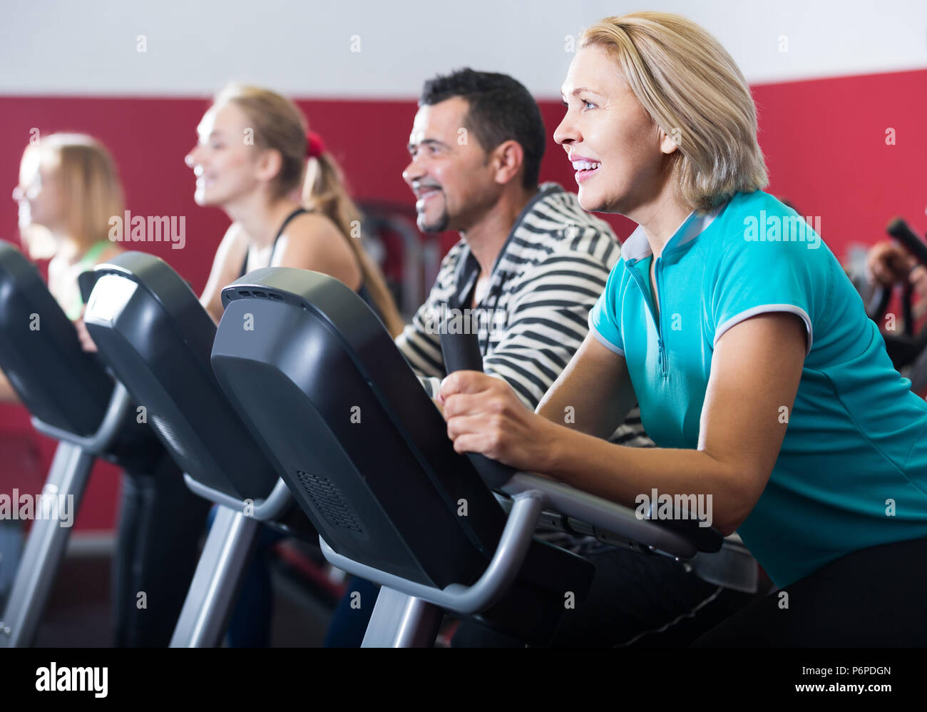 positive american adults in gym working out at group class Stock Photo ...
