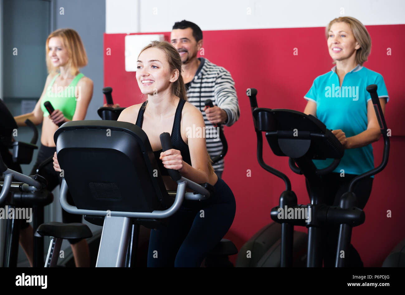 Active adults in a fitness center working out at group class Stock ...