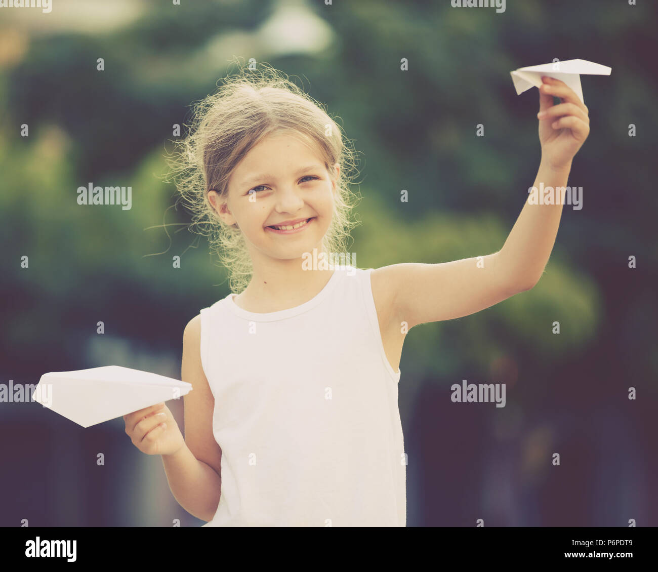 Happy girl throwing simple hi-res stock photography and images - Alamy